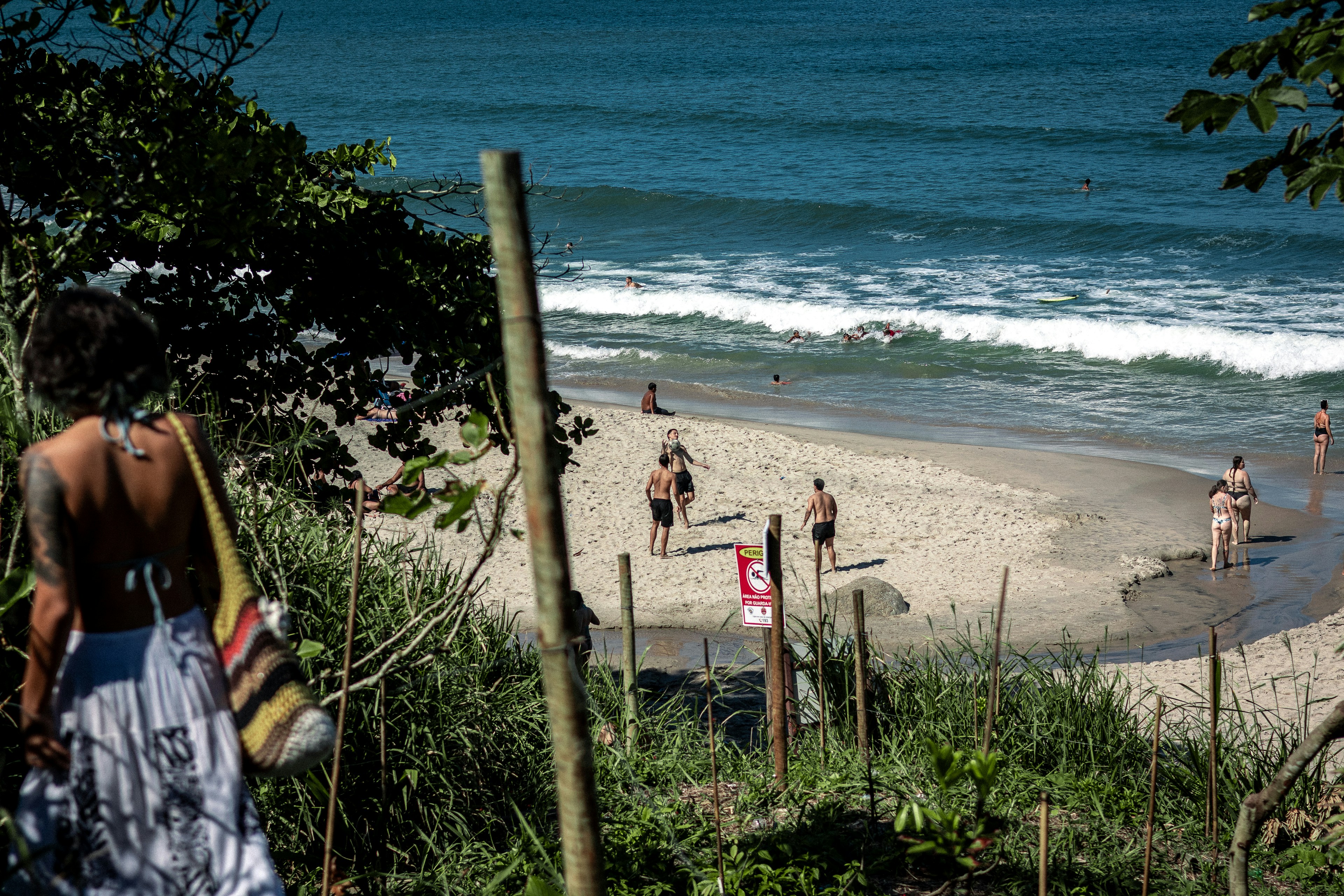 Coastal Path: Beachgoers and Ocean View from the Dunes