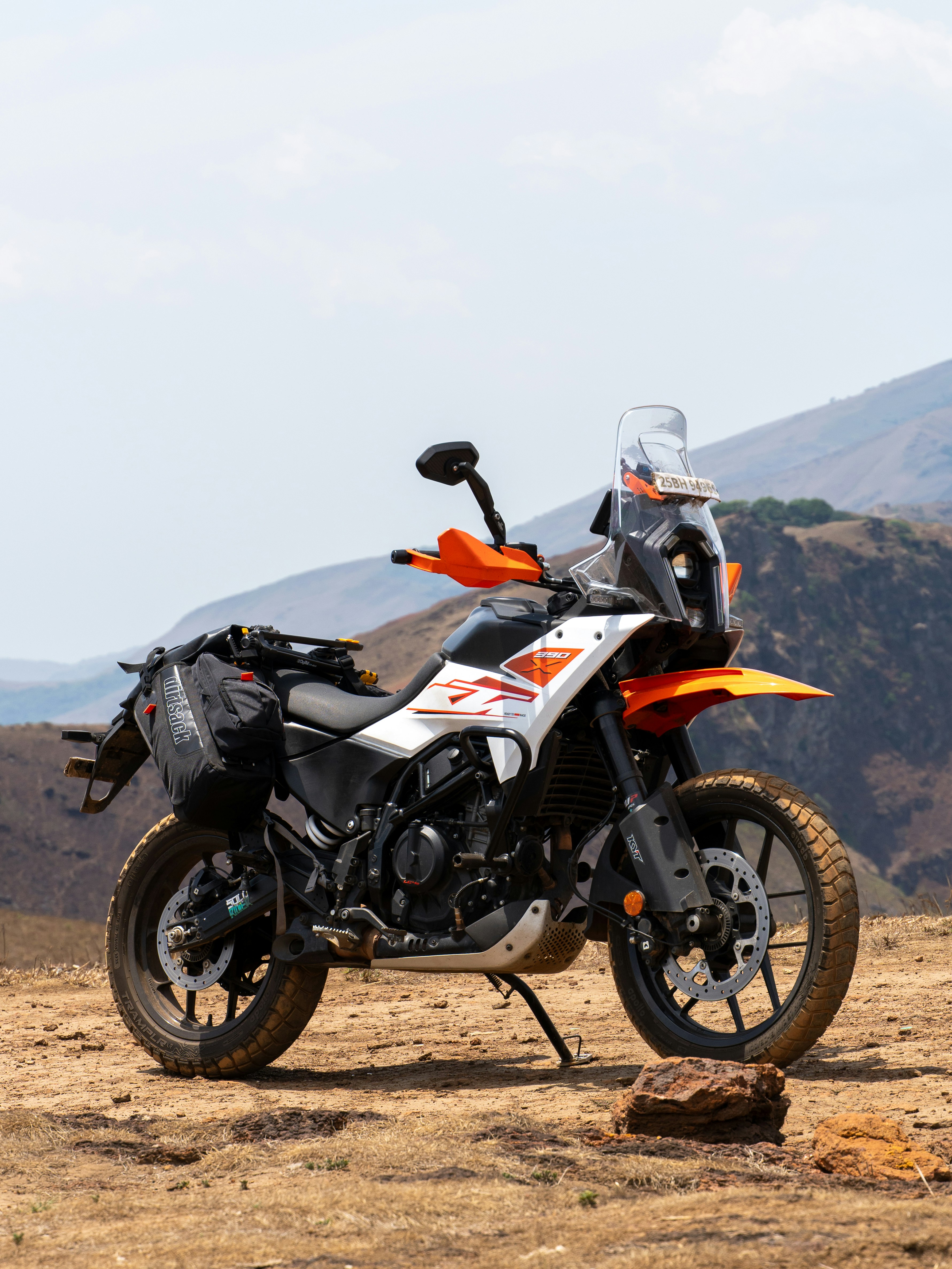 Adventure Ready: Orange KTM Standing Guard Over a Arid Ridge