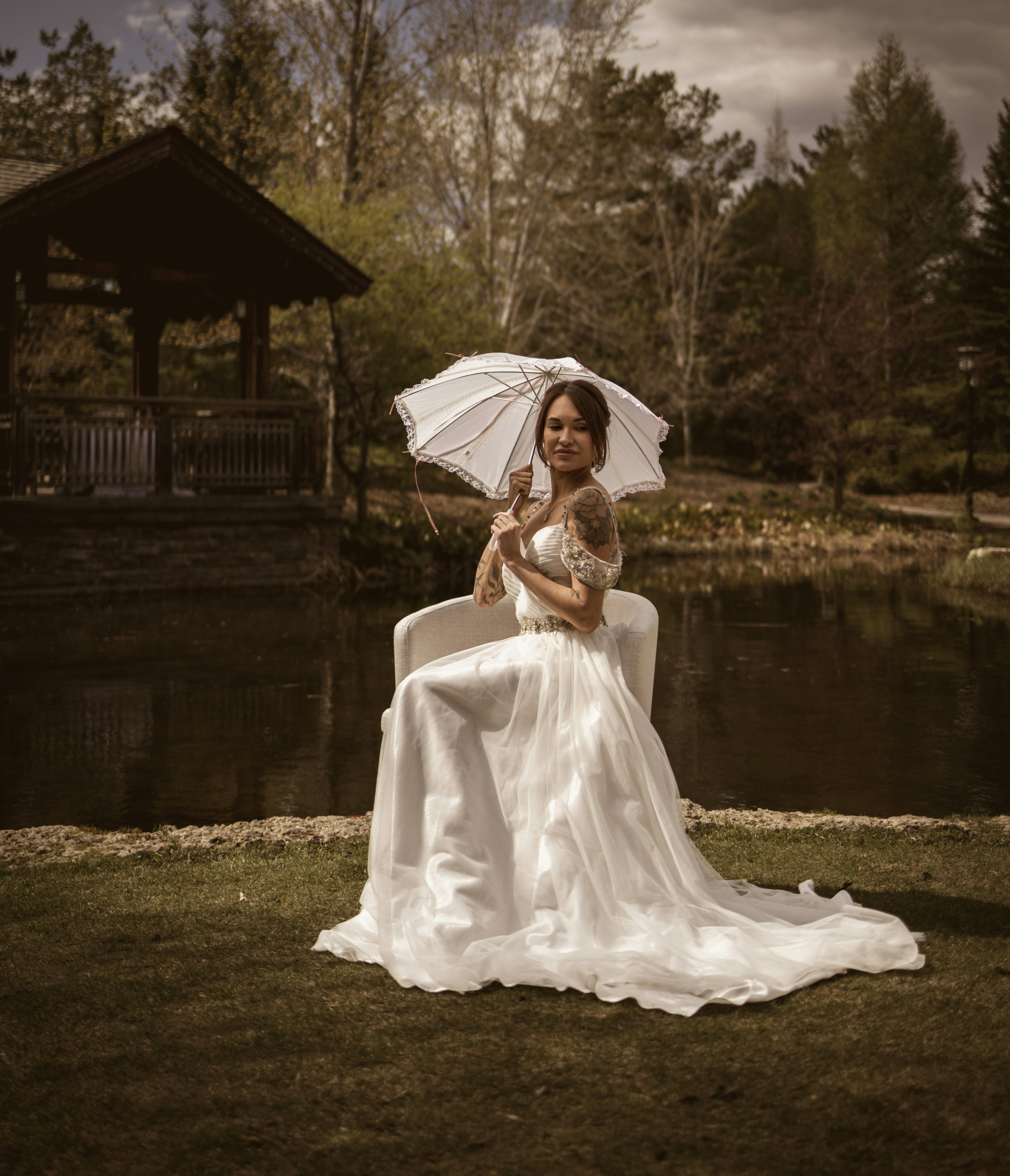 Bride in White on the Riverside Lawn