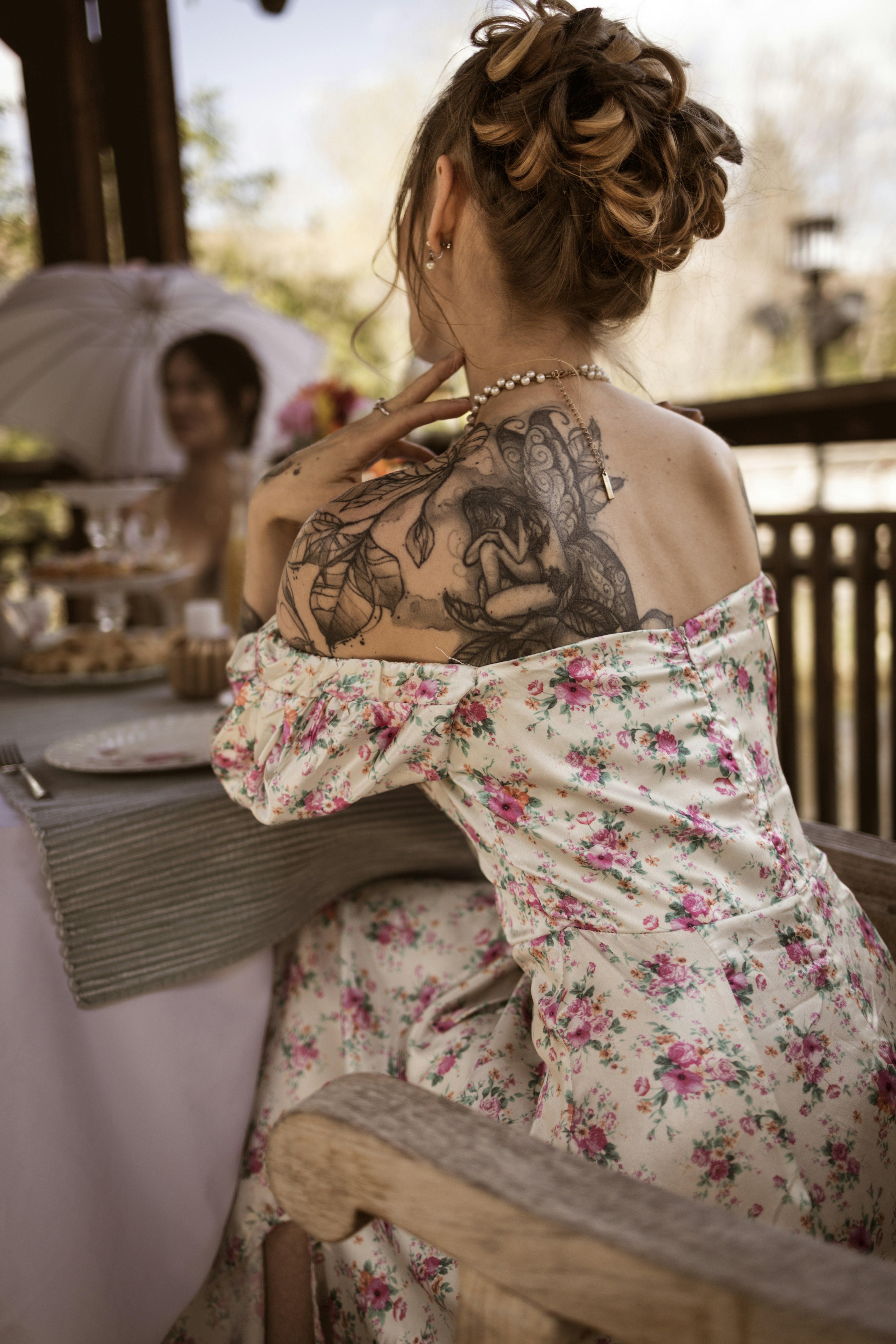Tattooed Back at the Table: A Floral Morning Dress Moment