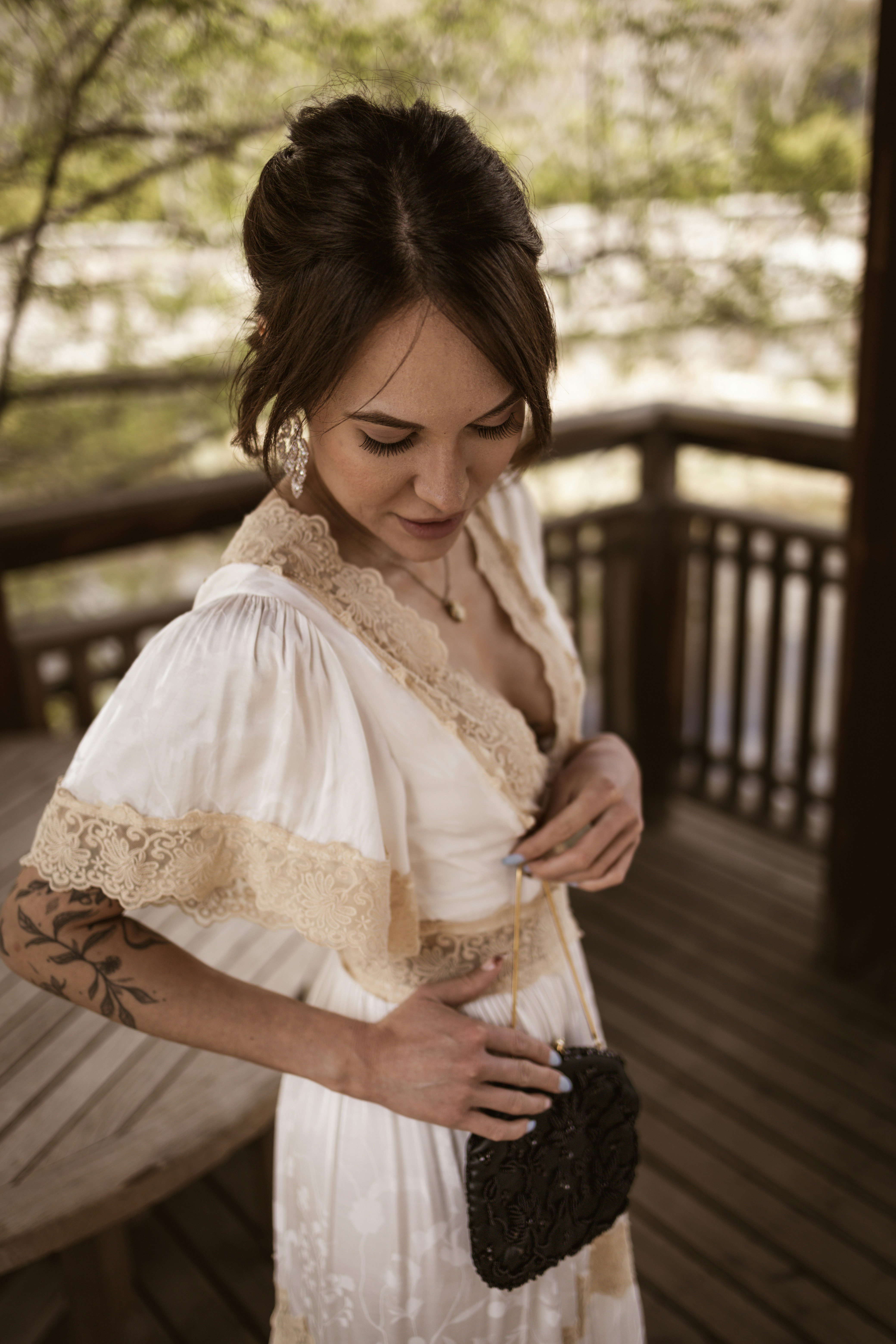 Bride in lace and twilight woodscape
