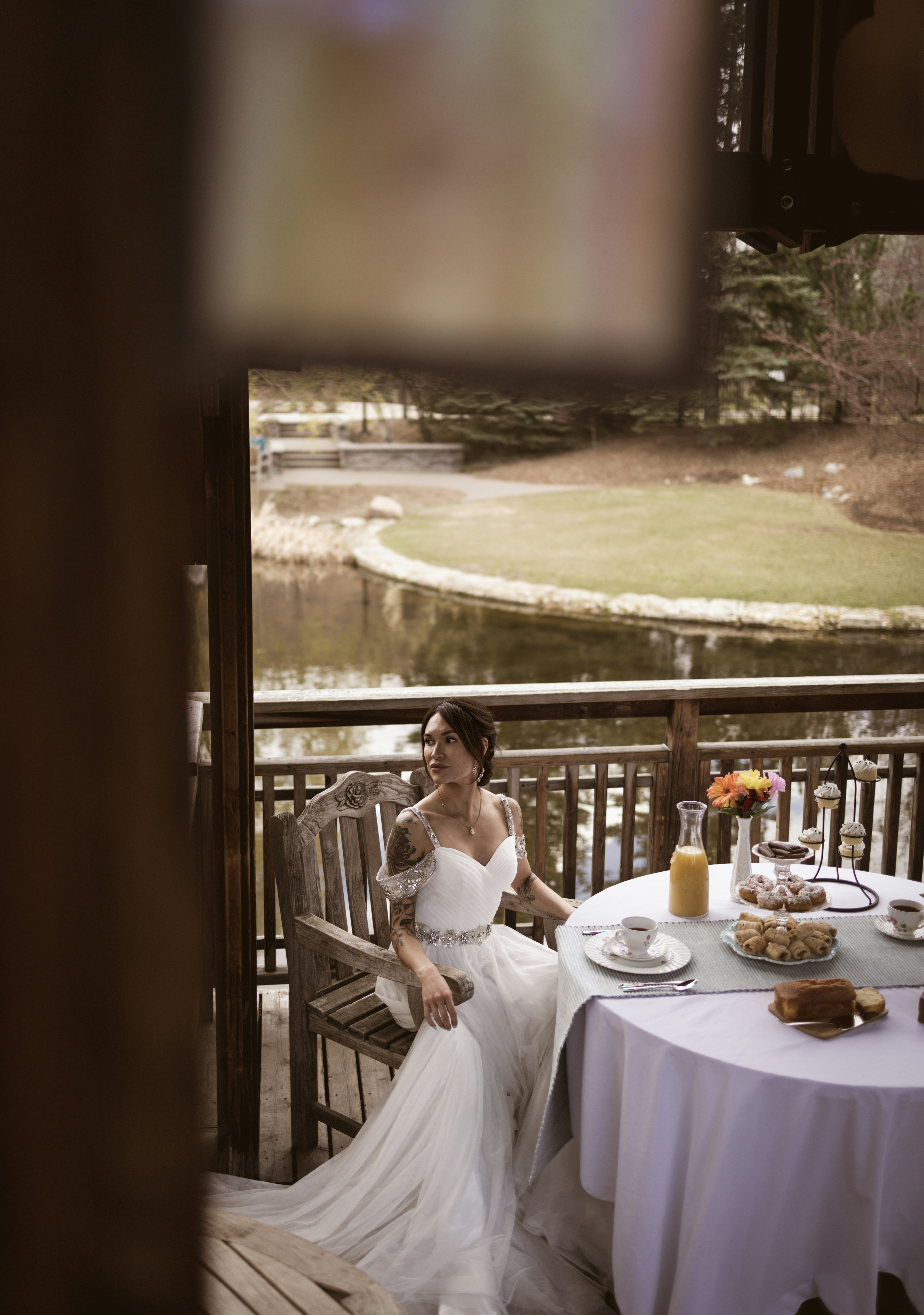 Bride on the Veranda: Quiet Moment by the Waterfront Table