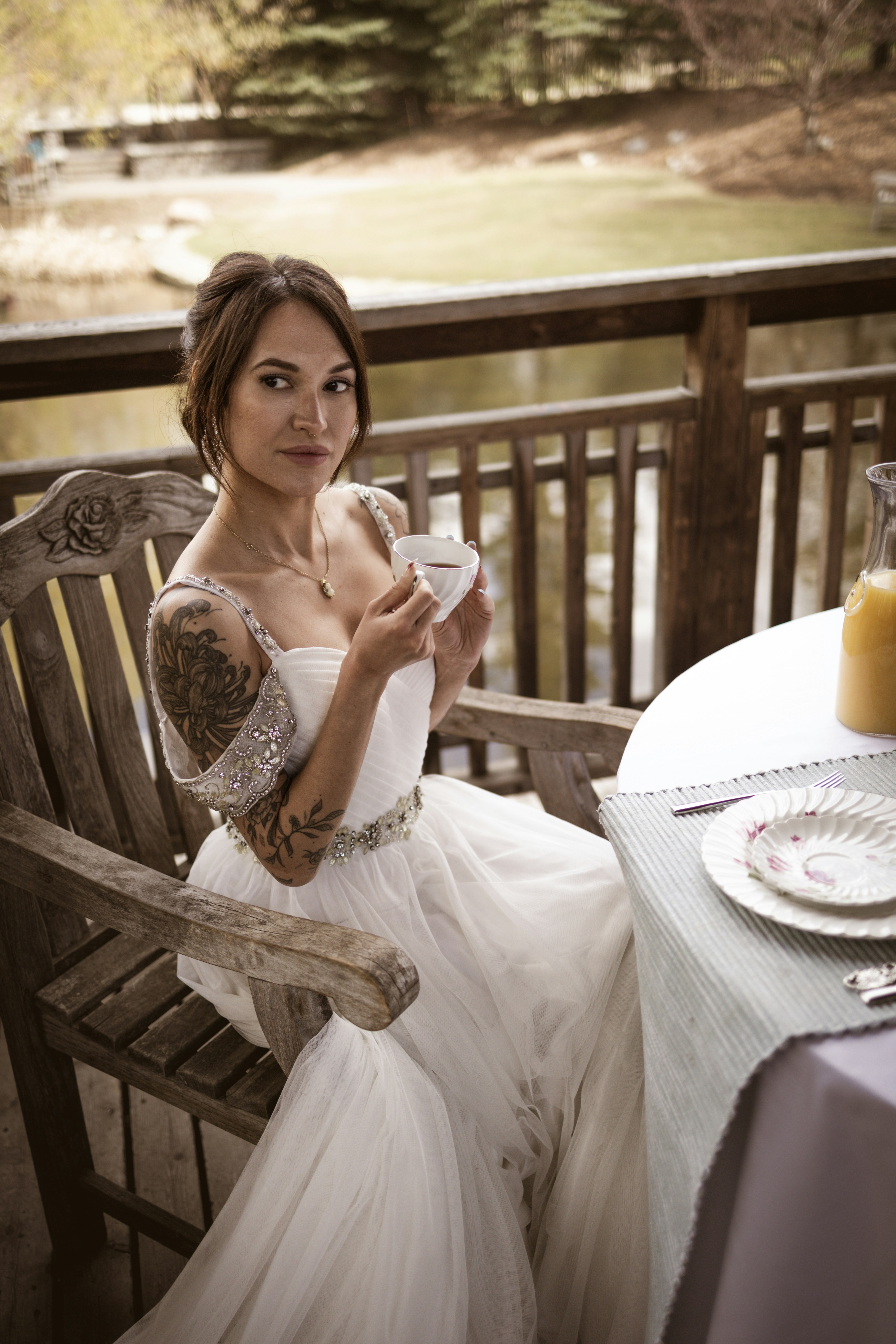 Tea on the Terrace: A Bridal Moment Amid a Garden of Wood and Light