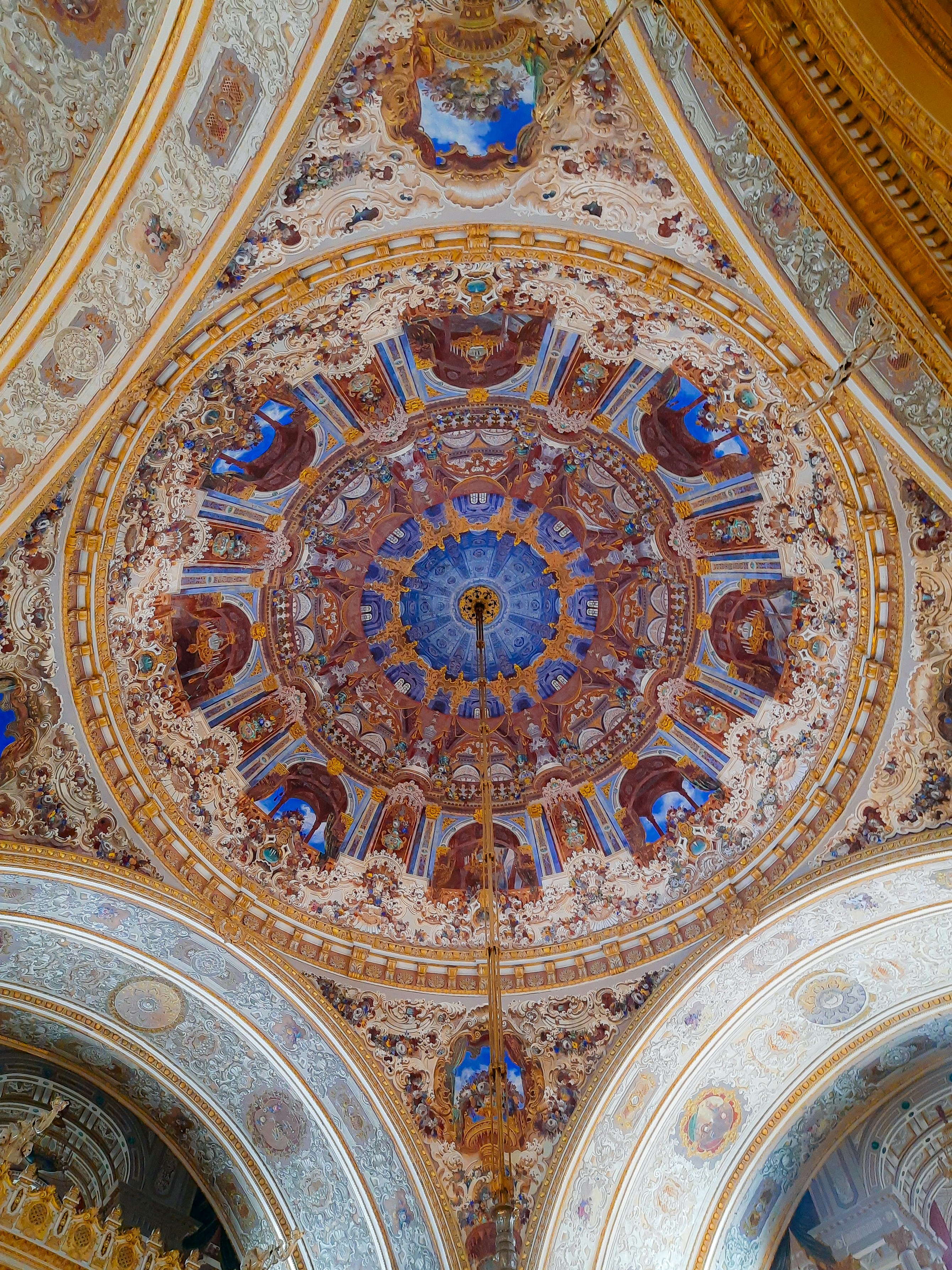 Ceiling Constellation: A Dragonfly of Colors in an Ornate Dome