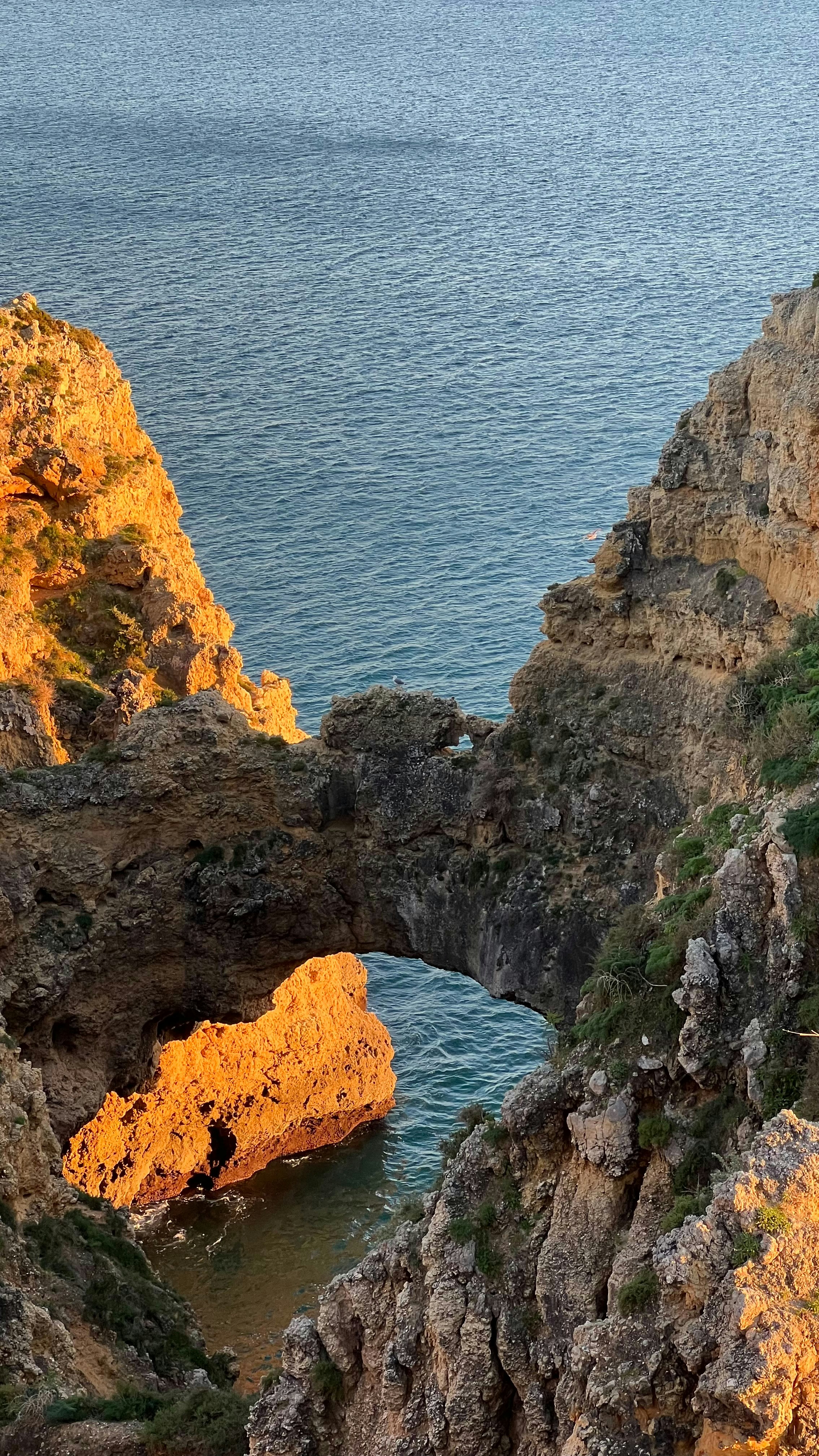 Sunlit Arch Over the Azure Sea