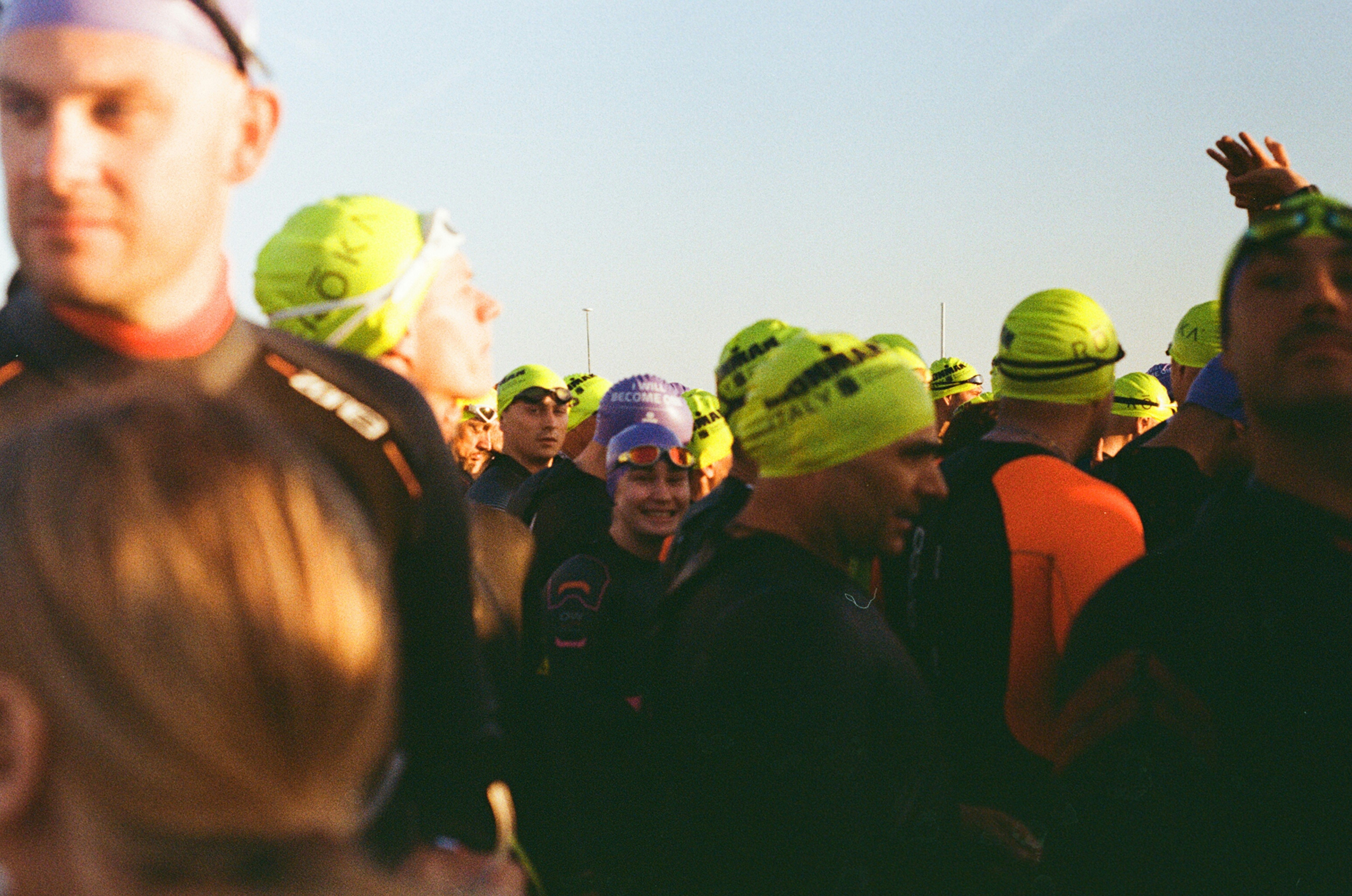 Triumph of the Tide: A Sea of Neon Caps at Dawn