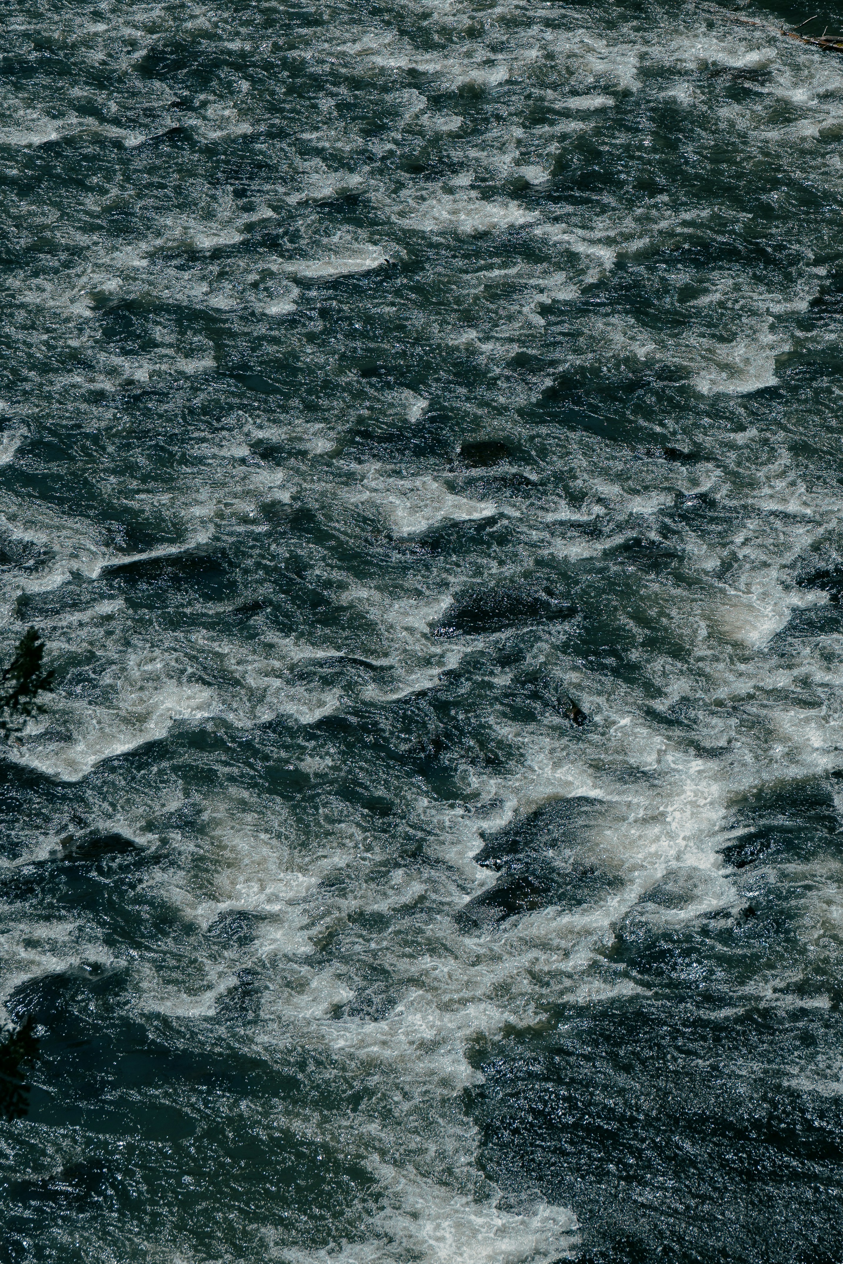 Whirlpool Veil: A Close-Up of Turbulent Peaks on Dark Waters
