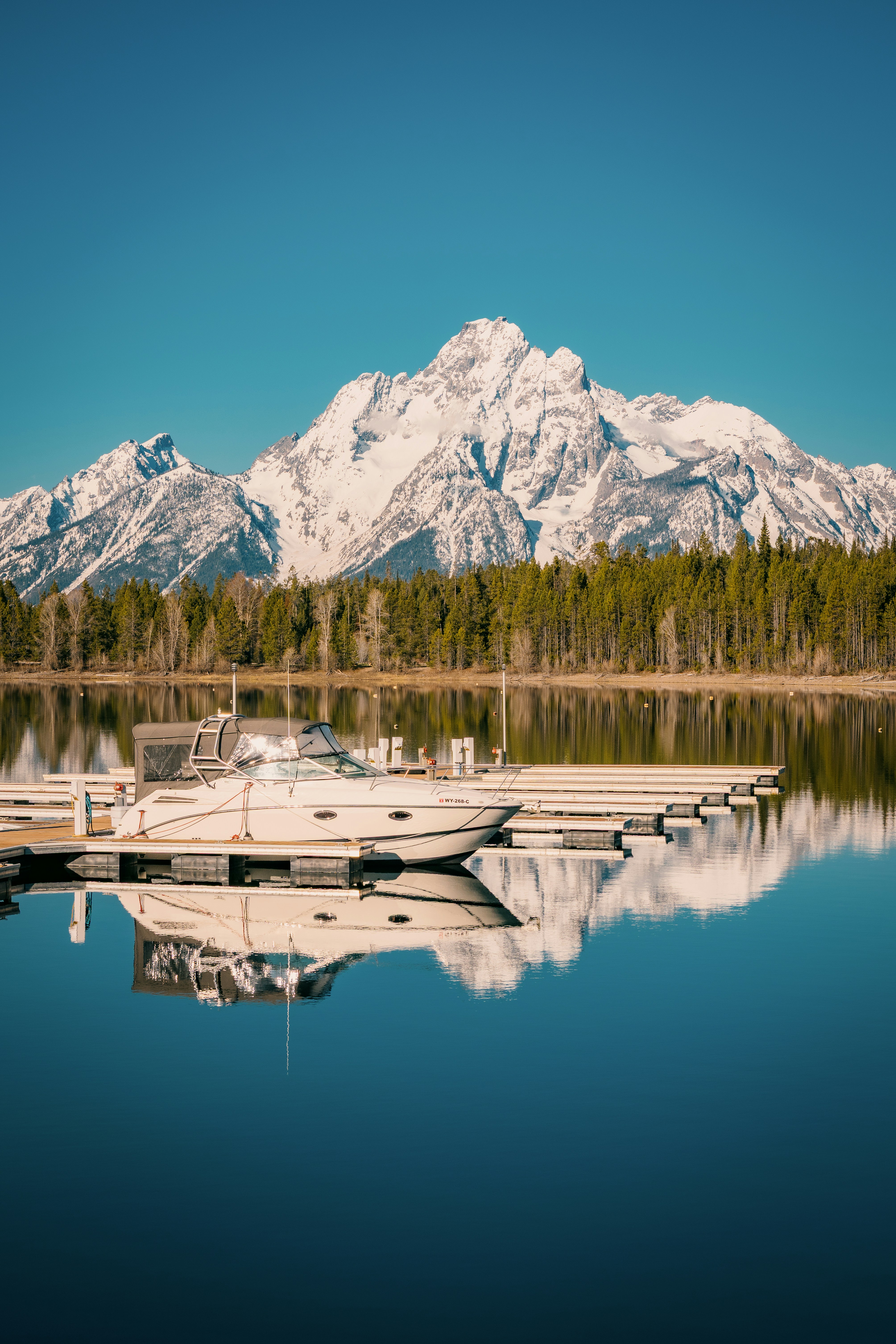 Snow‑Crowned Peaks Over a Quiet Marina