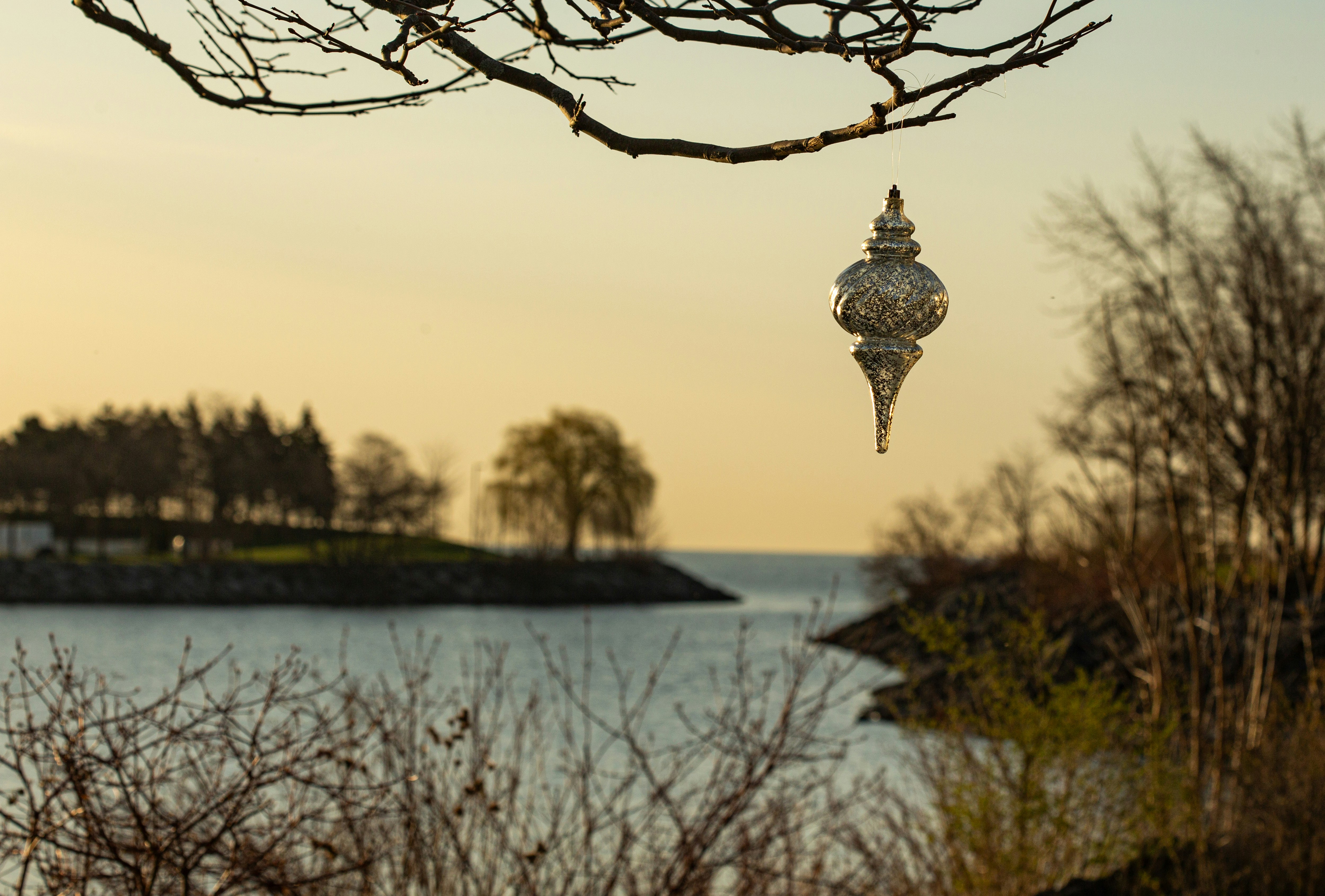 Hanging Lantern Over a Quiet Lake at Dusk