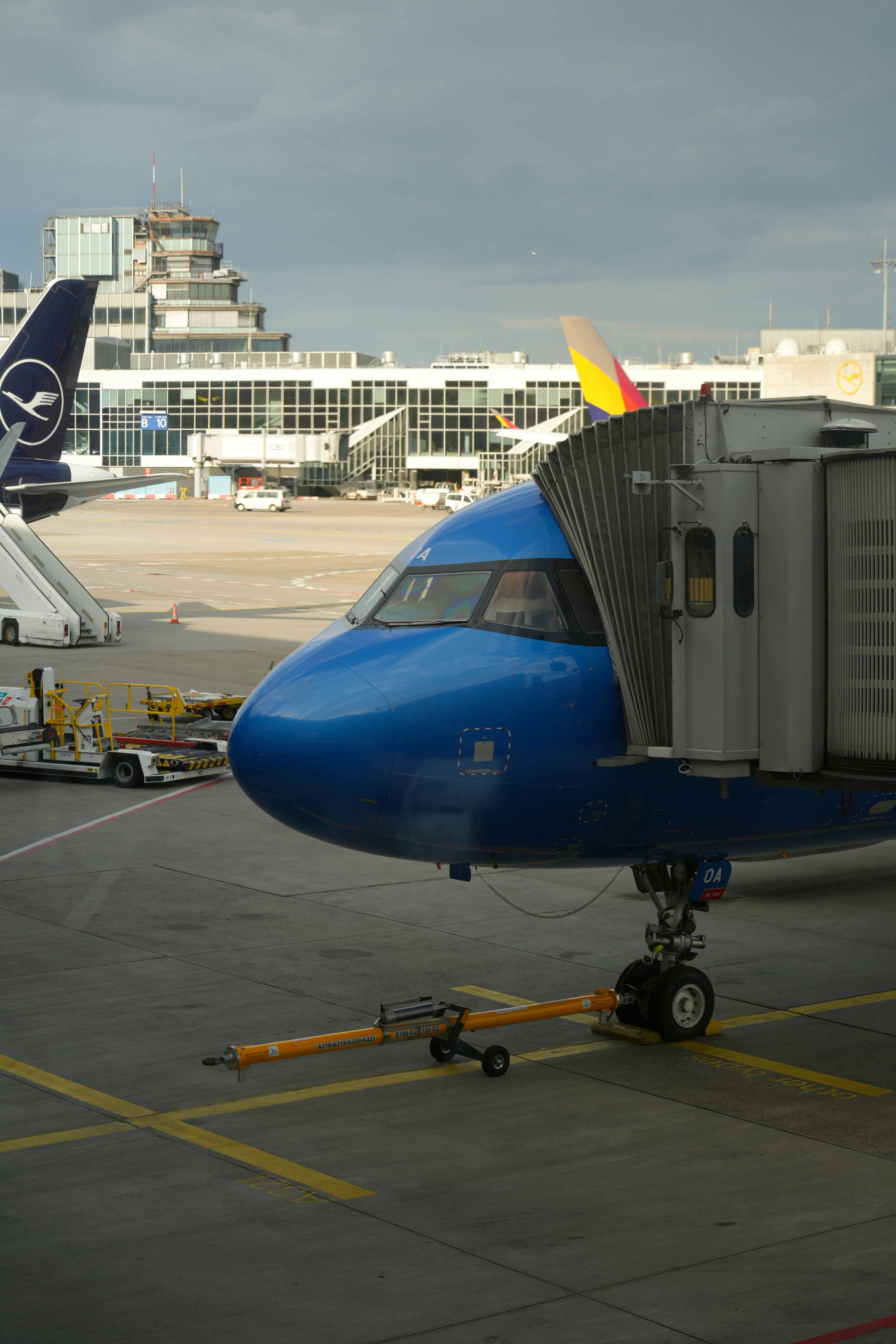 Blue Jumbo Jet at the Gate: A Quiet Moment on the Apron