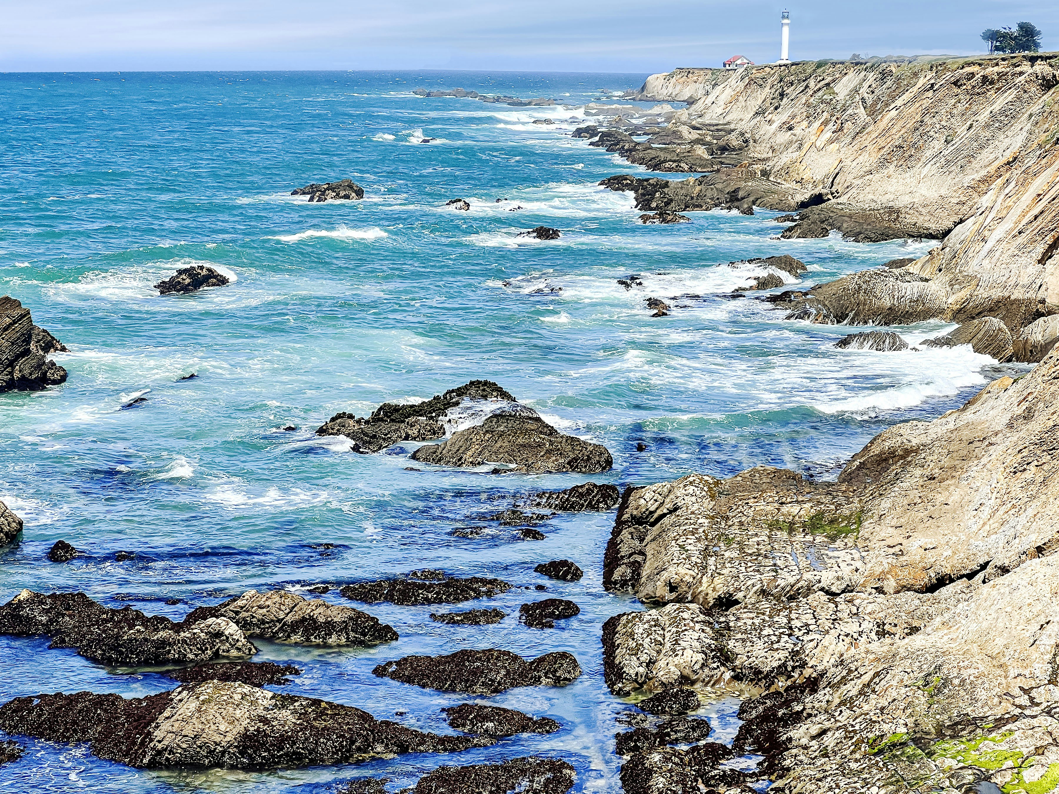 Lighthouse Silhouette over the Azure Cliffline