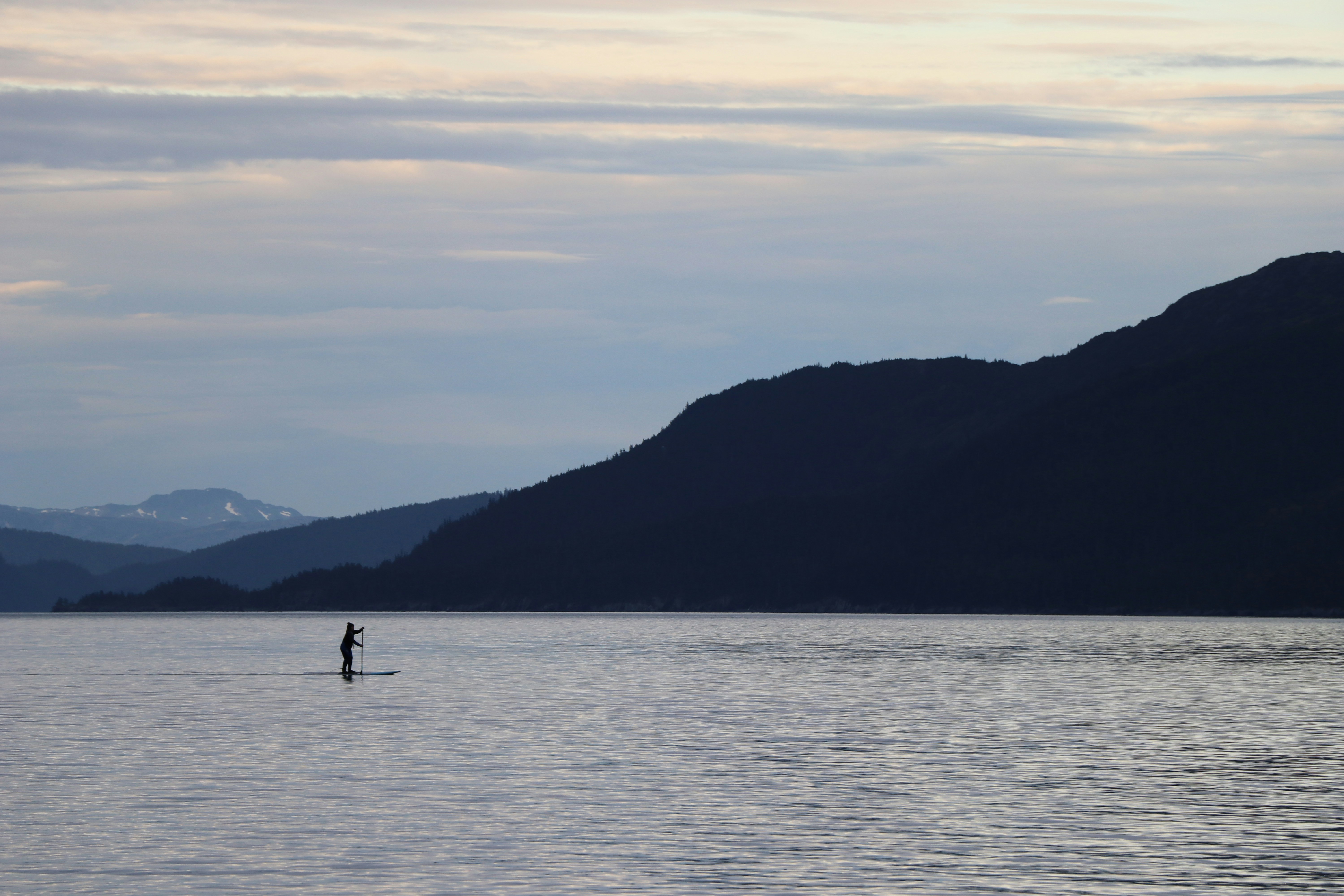 Solo Paddler at the Edge of Dusk