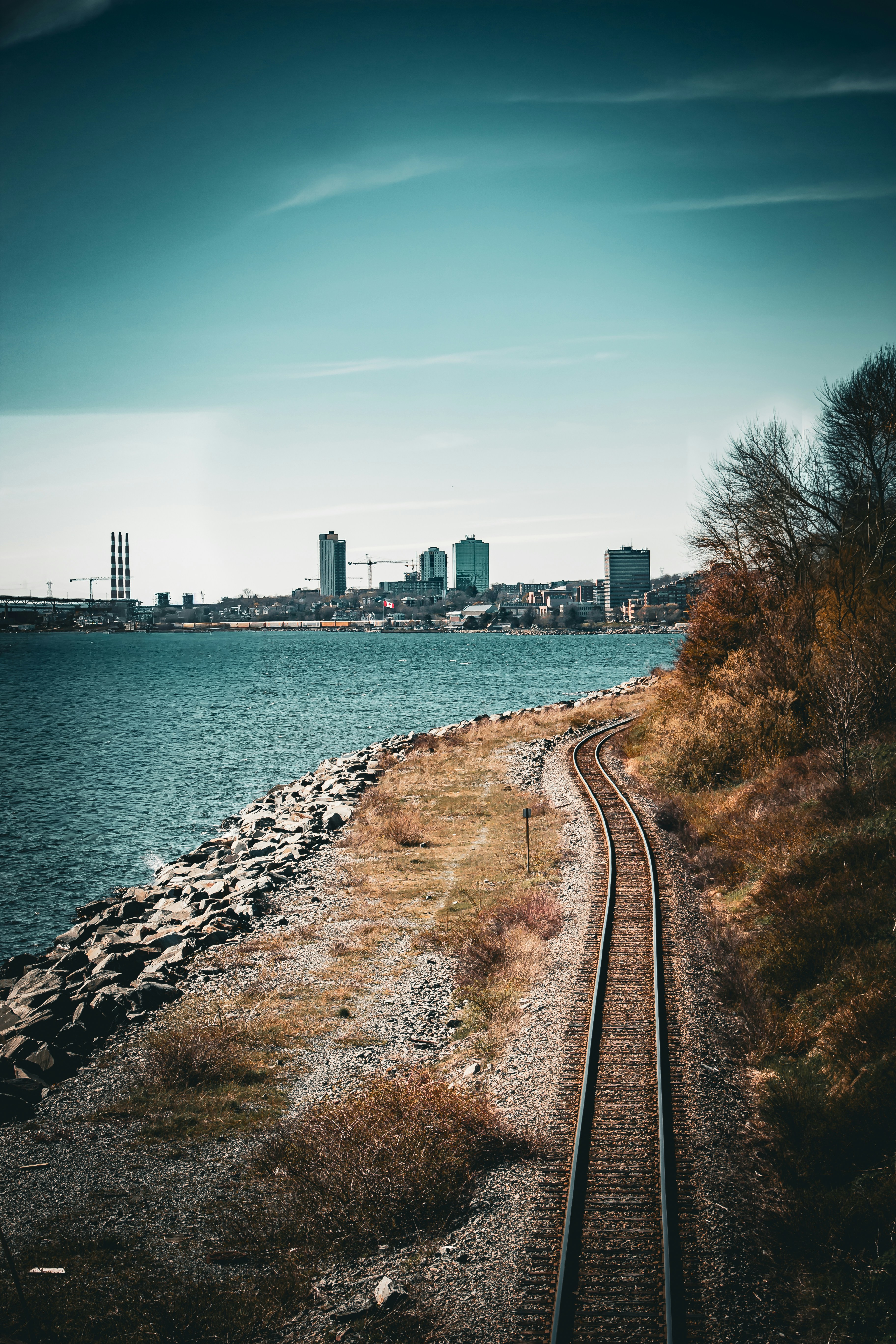 Railway Stretch by the Water: A Calm Line to the City