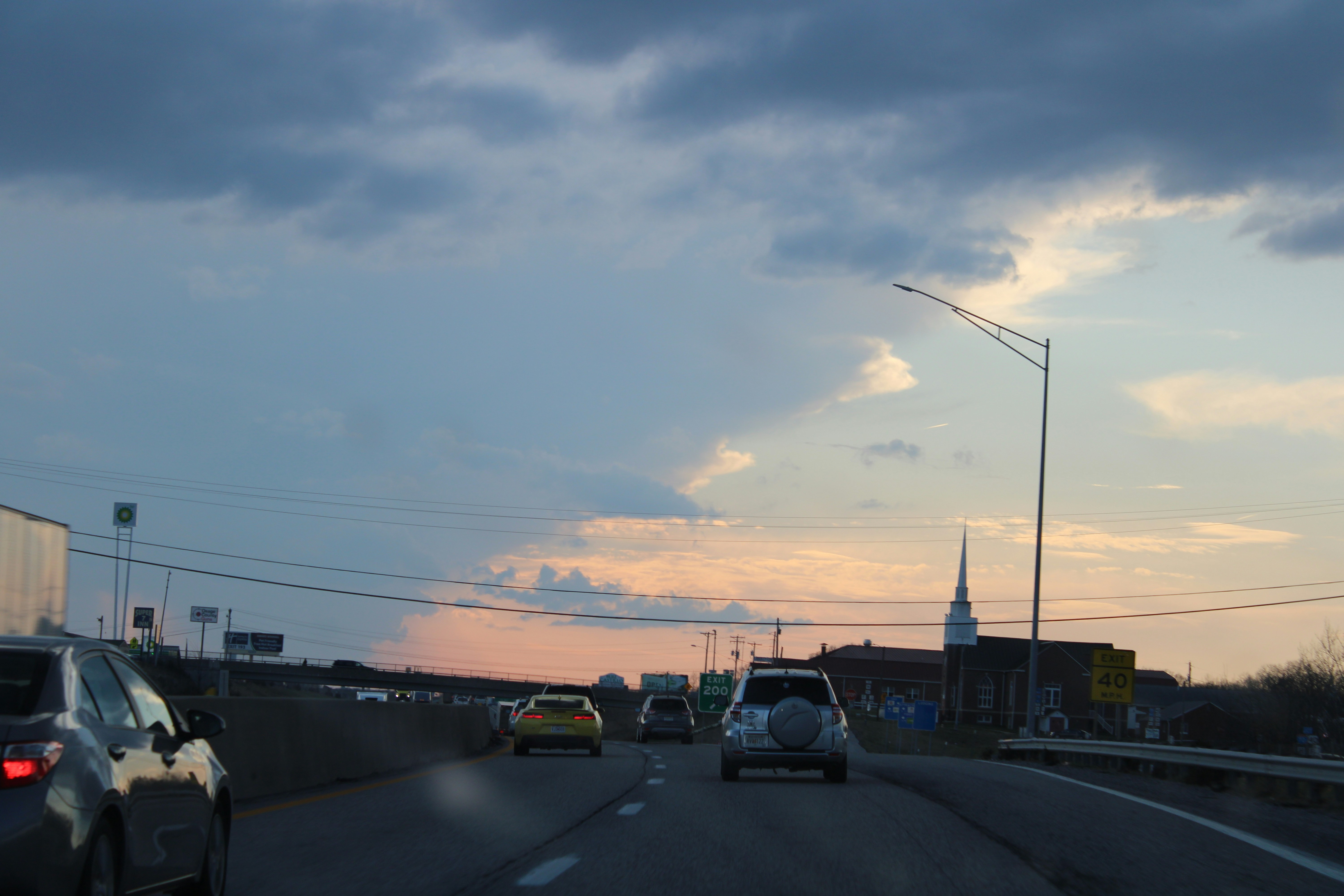 Onramp at Dusk: Lines, Lights, and the Long Road Ahead