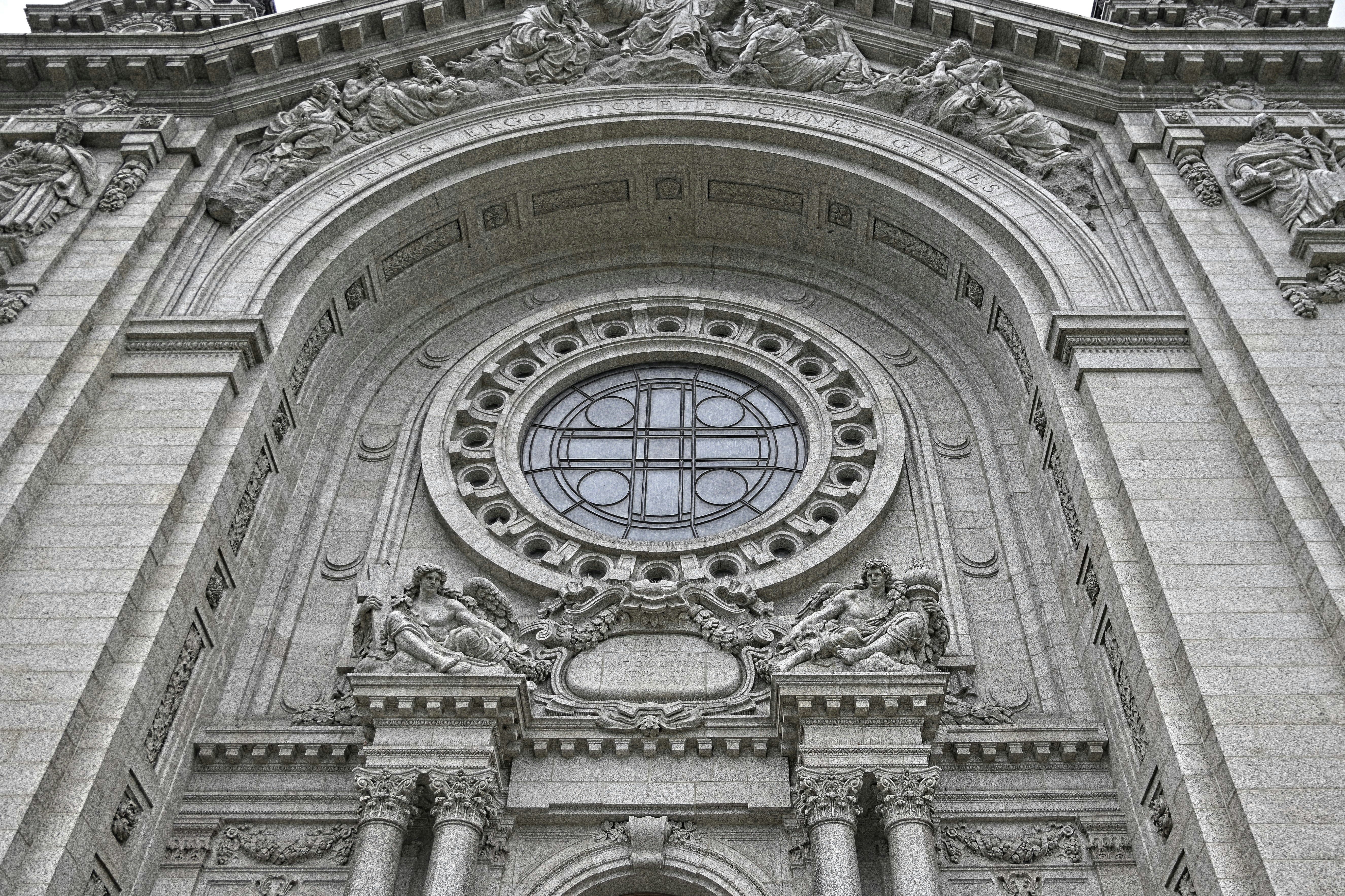 Stone Circles and Carved Grace: A Facade of Circular Window and Relief