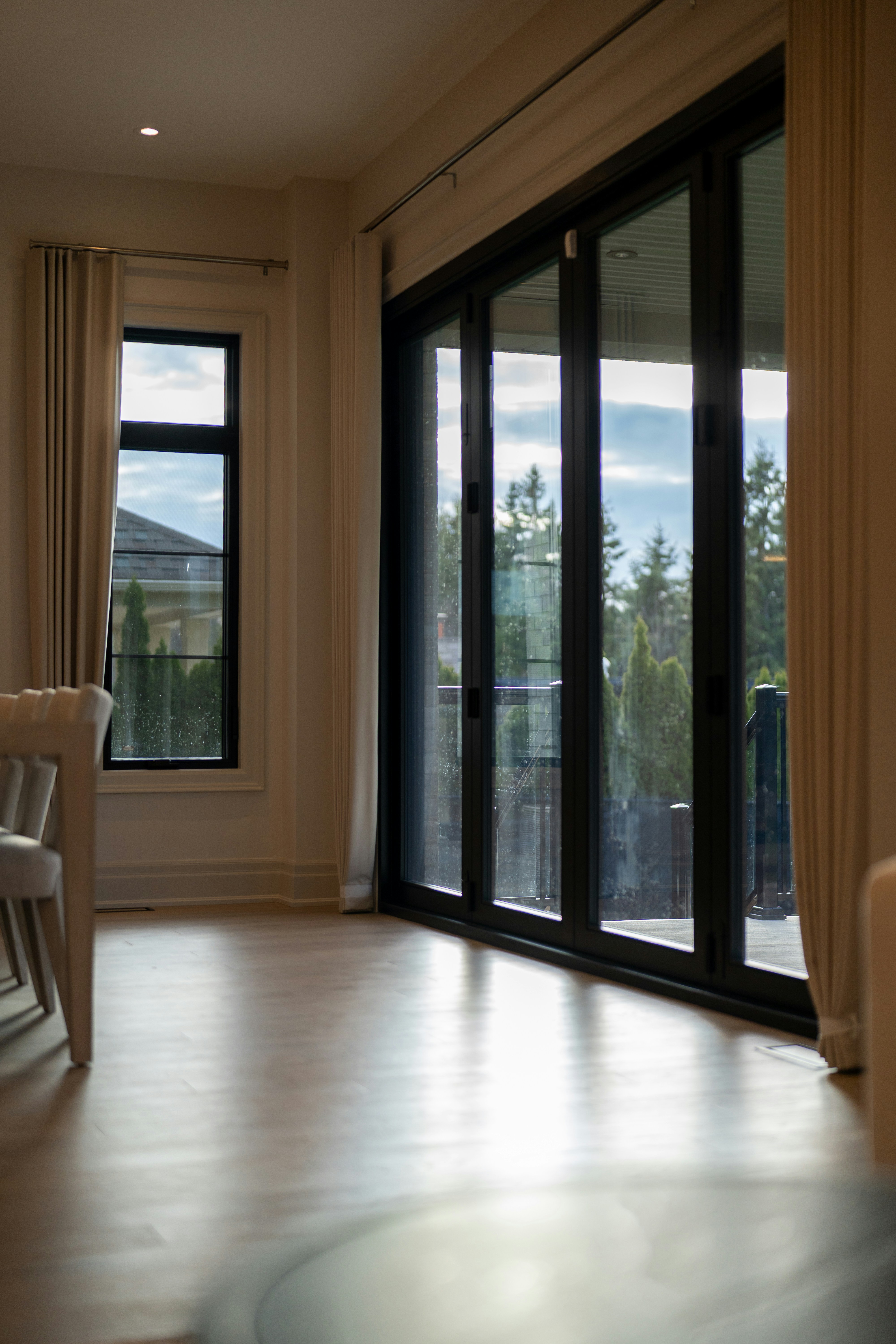 Sunlit Terrace Through Sliding Doors: Quiet Modern Interior