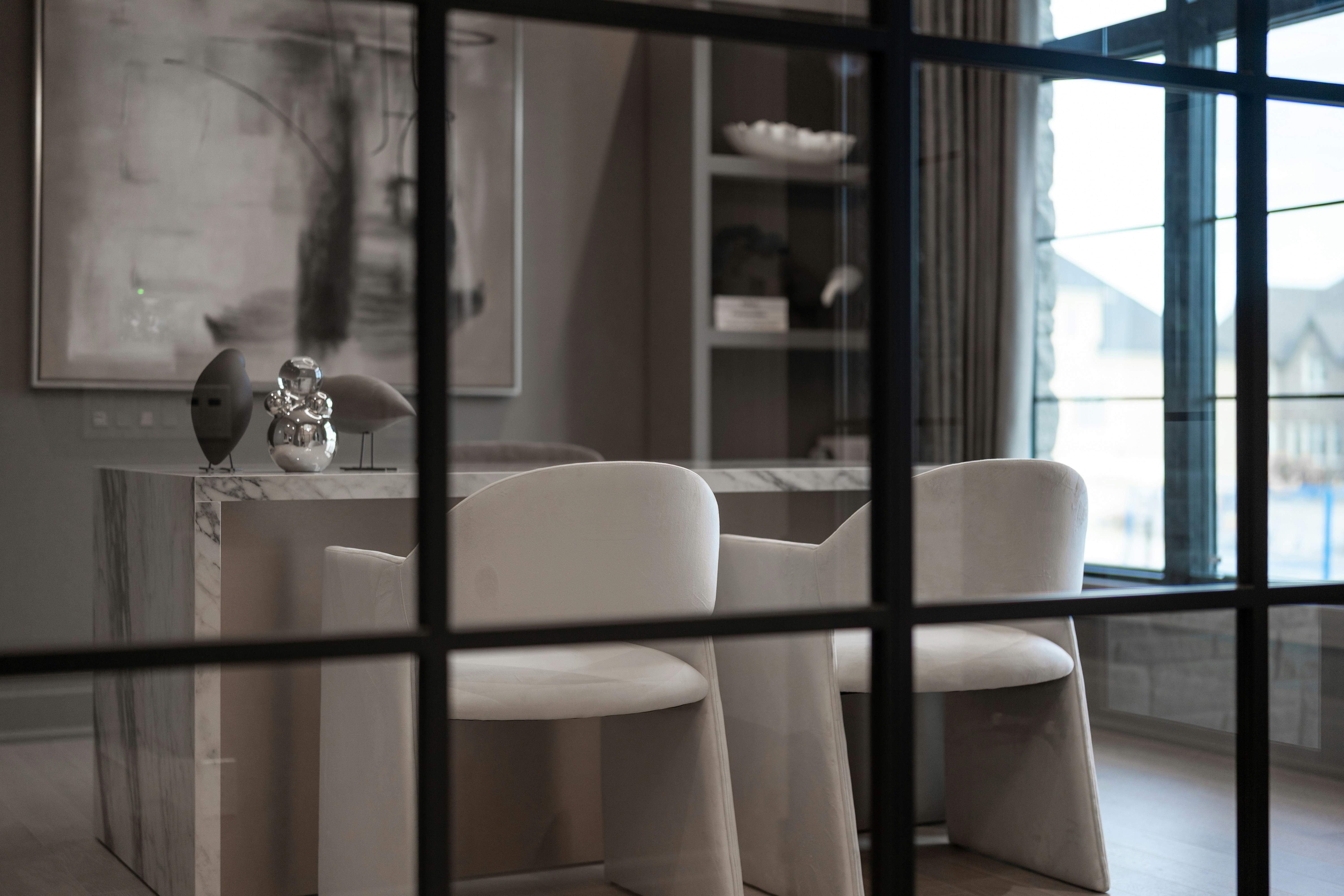 Muted Interior through a Grid of Windows