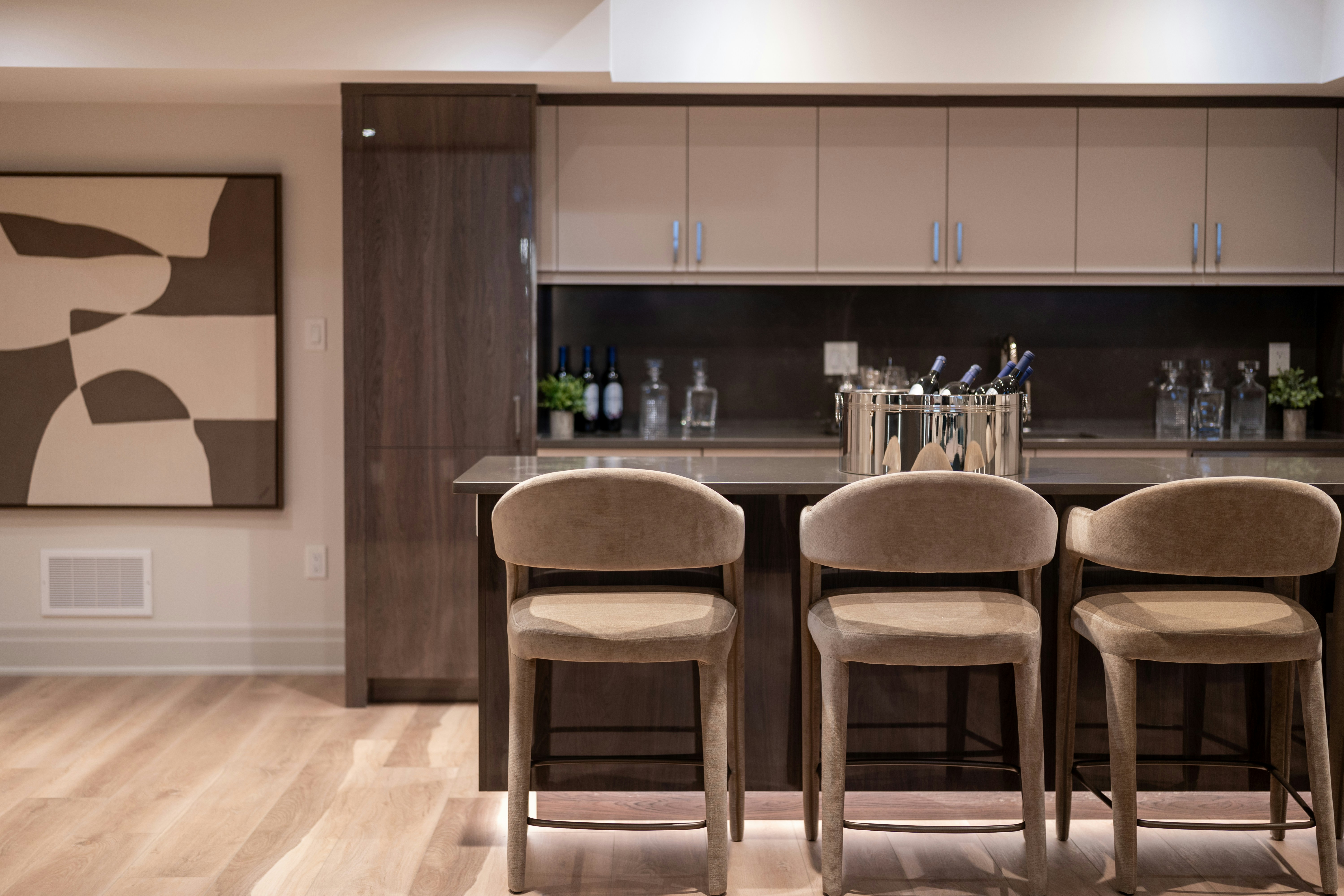 Quiet Hospitality: A Sleek Home Bar with Plush Stools