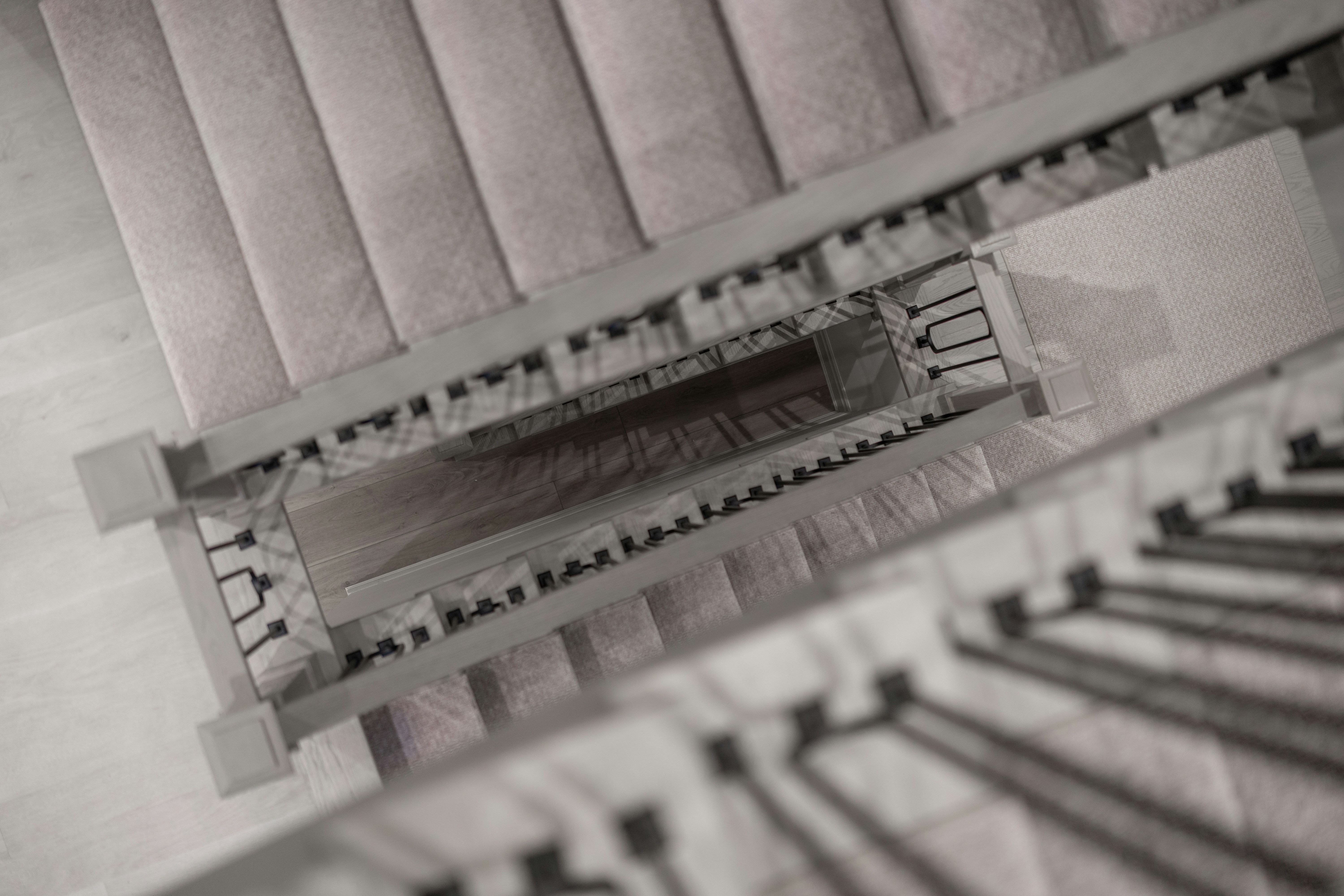 Aerial Descent: The Spiral Staircase in Monochrome Angles