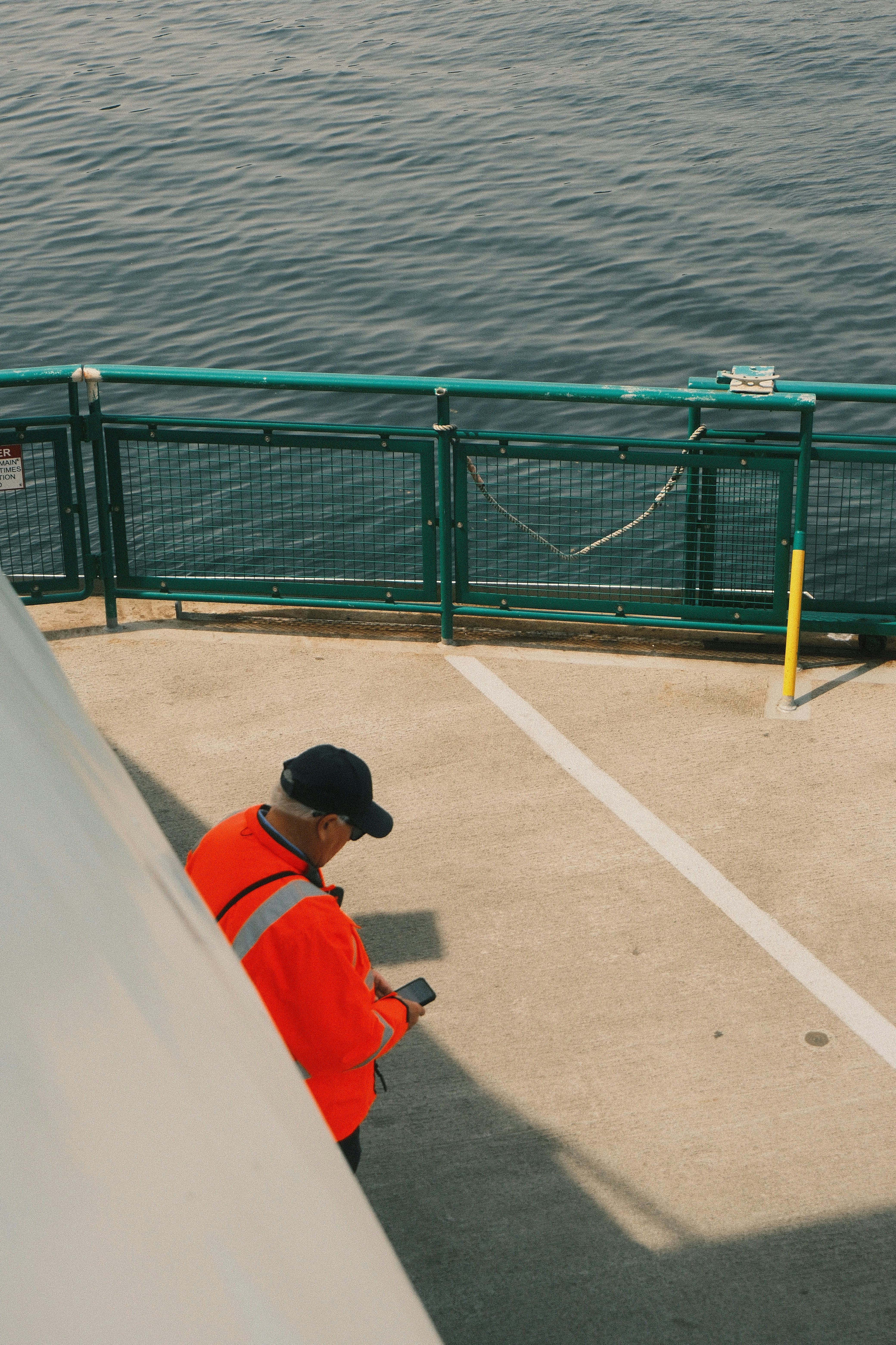 Harbor Walk: A Worker at the Edge of the Quiet Sea