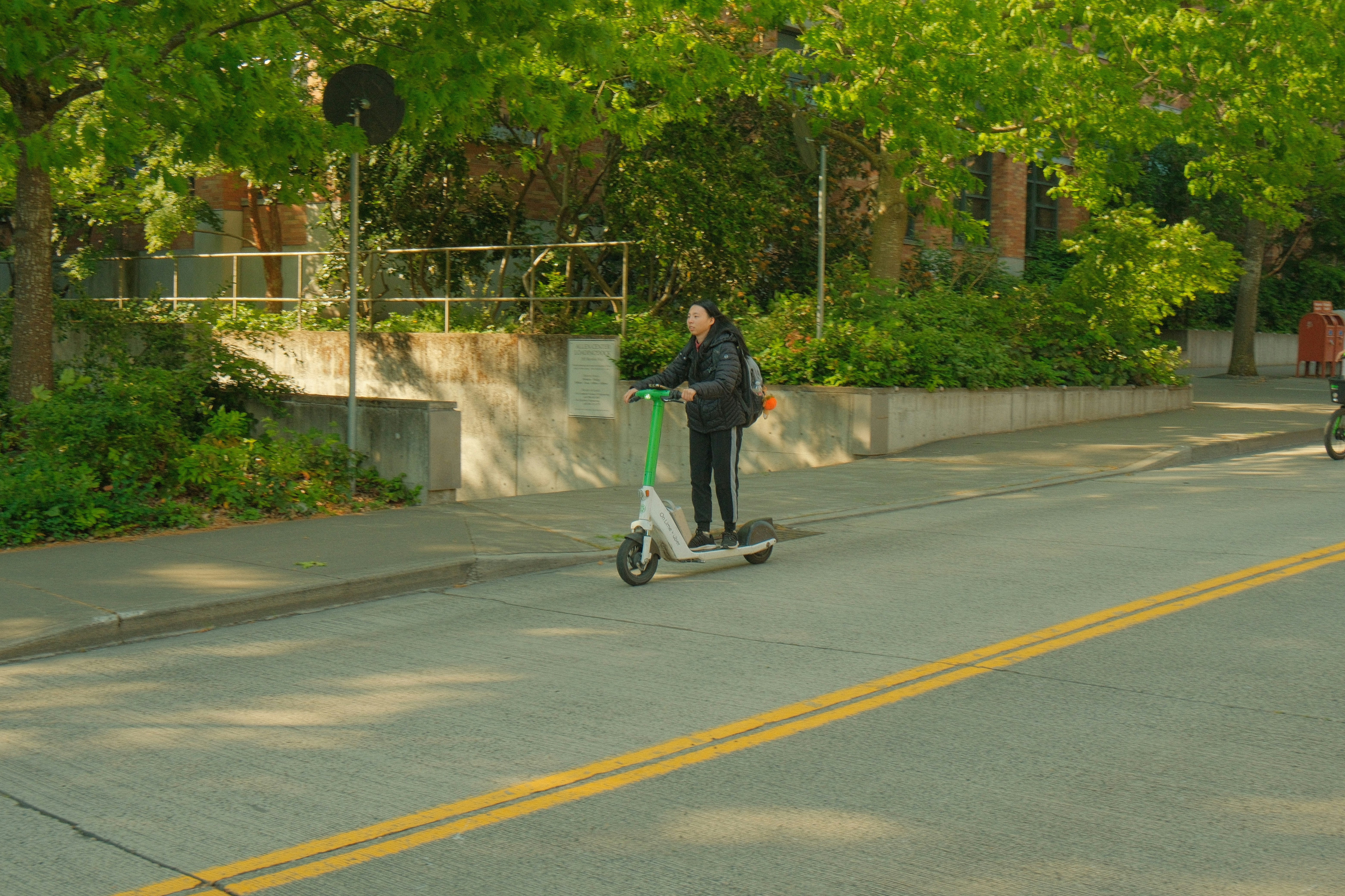 Evening Commute: Rider in the Quiet City Lane