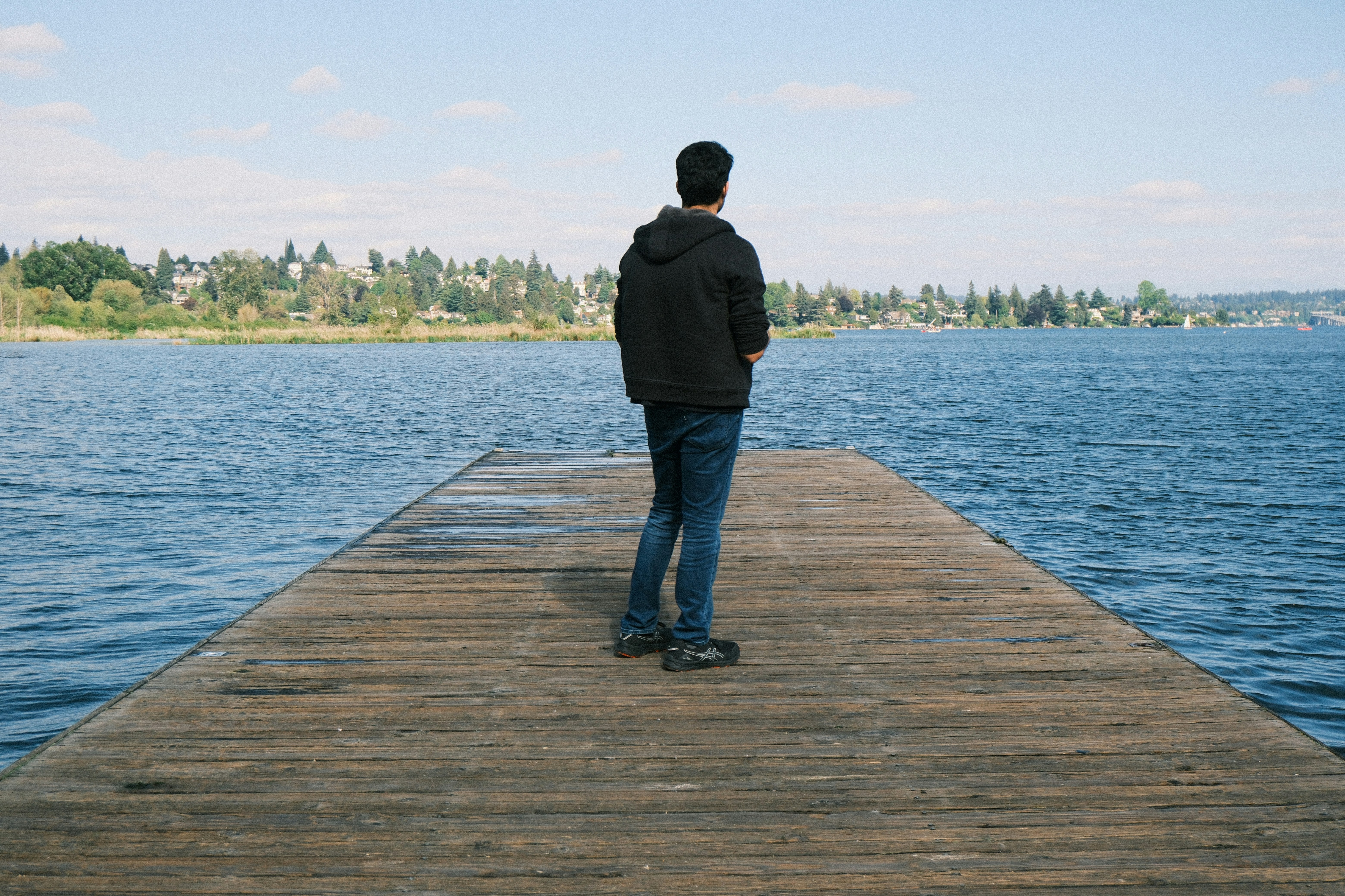 Alone at the End of the Pier: A Quiet Evening on the Lake