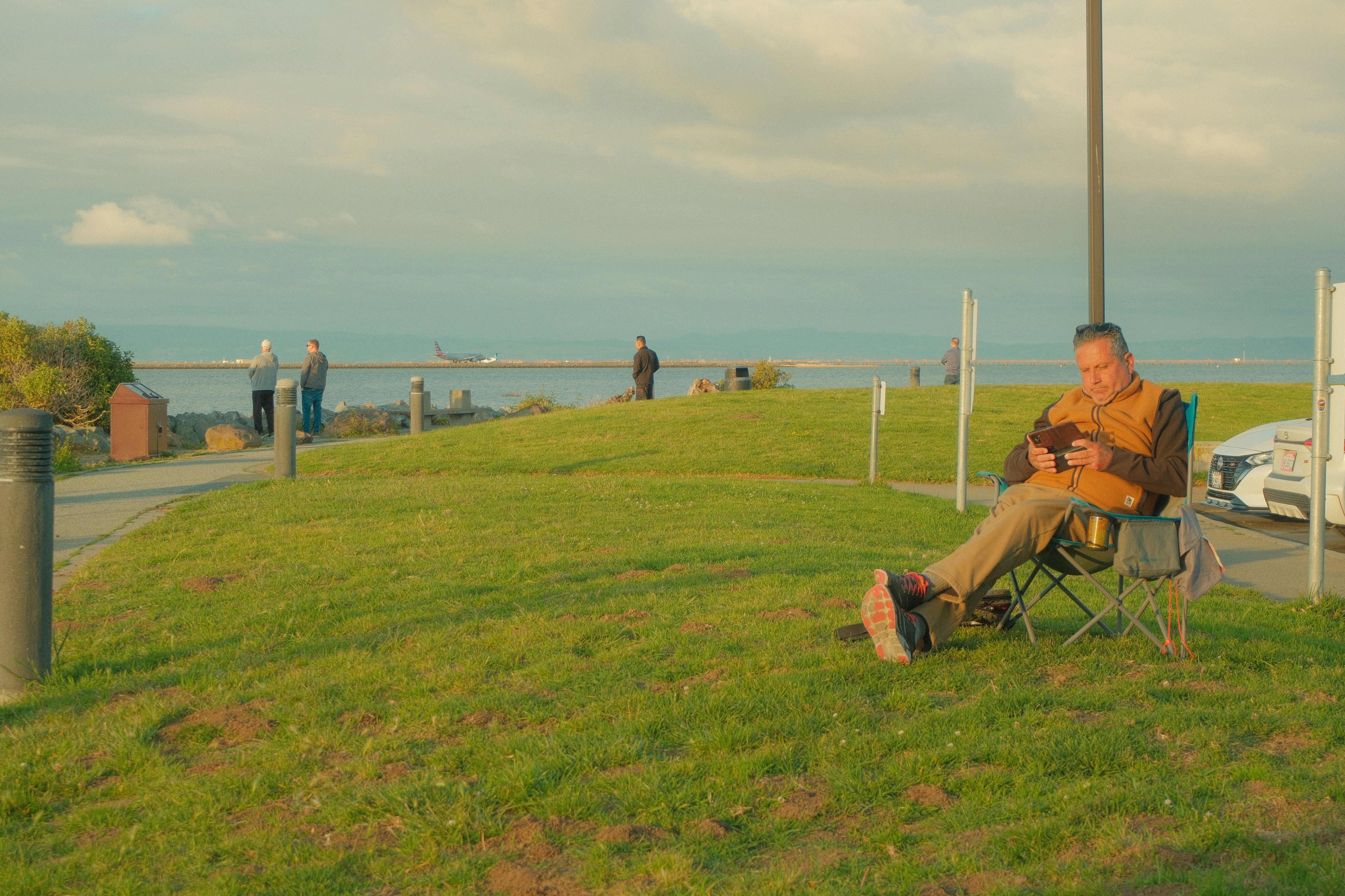 Sunlit Seaside Recliner: A Moment of Quiet by the Gradient Hill