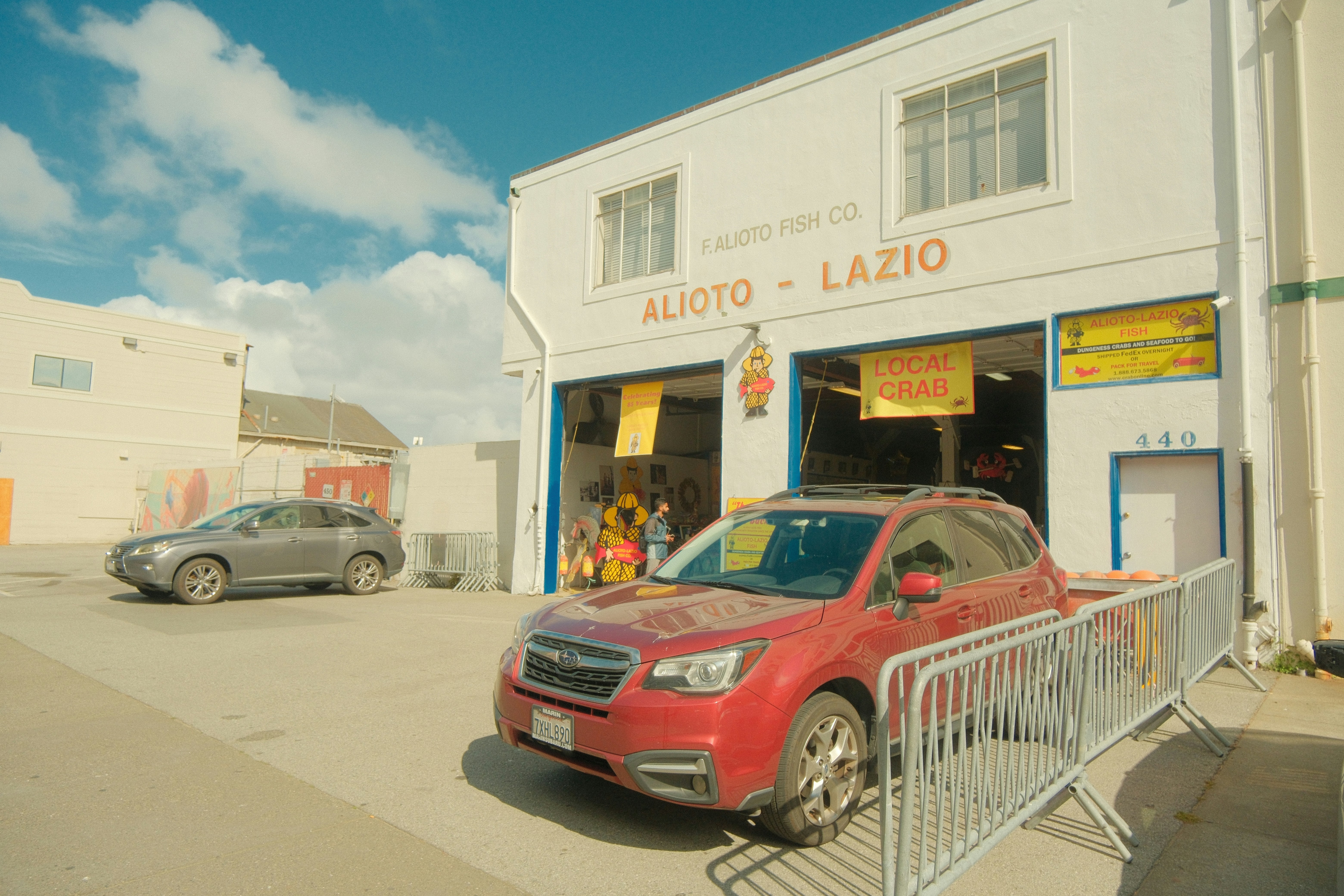 Red Pickup at the Local Crab Shop: A Sunny Day Front Scene
