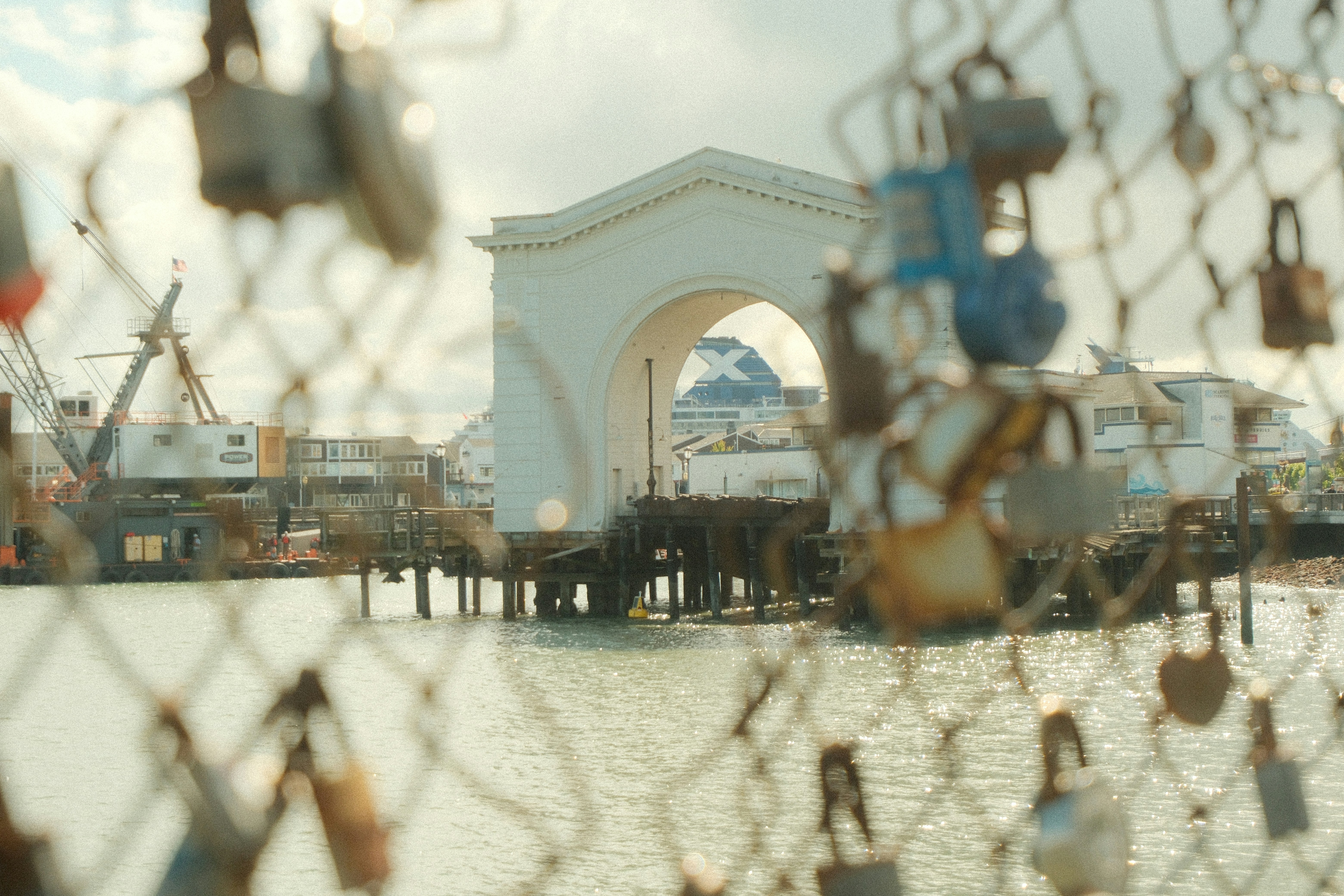 Locks of memory: a seaside pier framed by a lattice of love