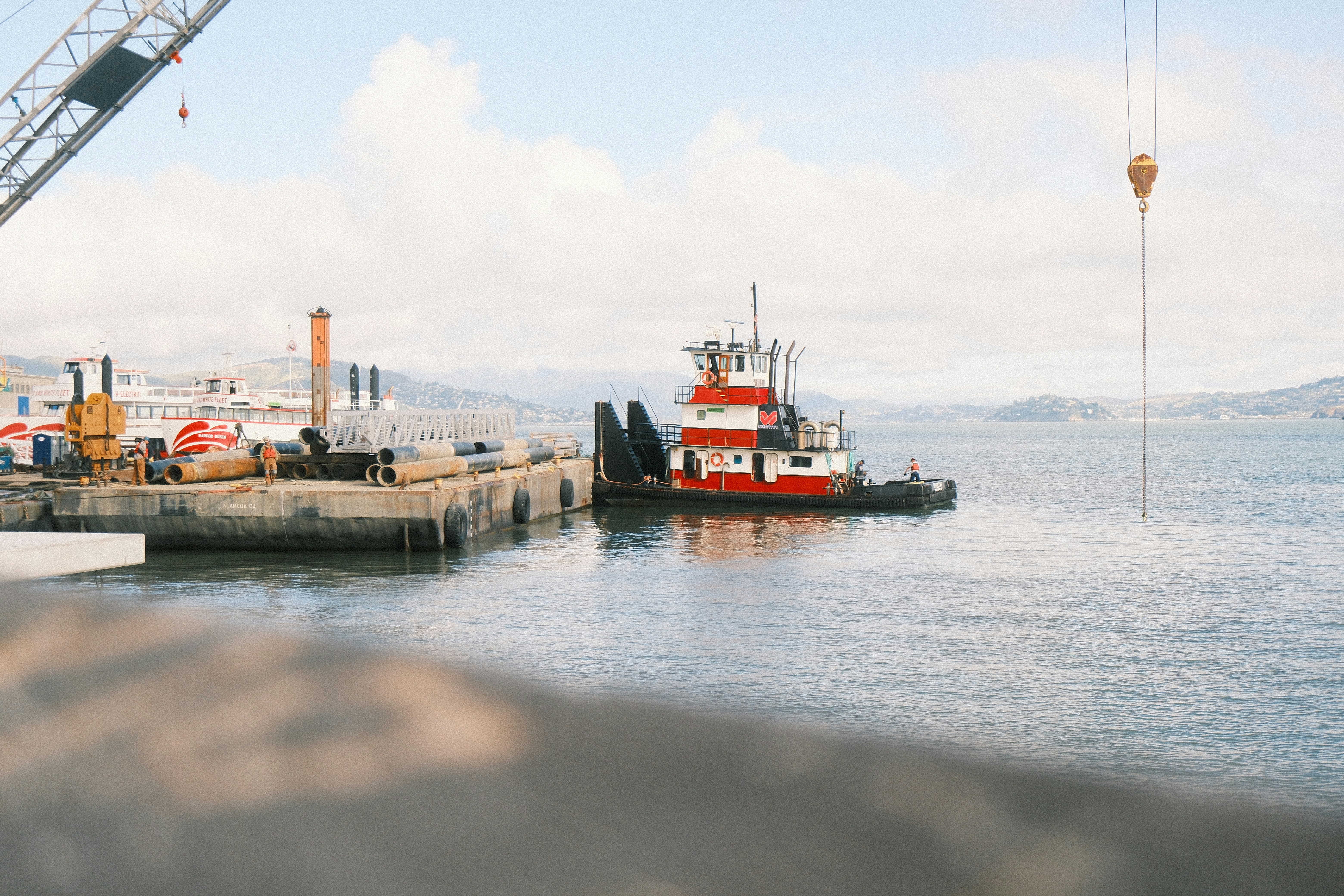 Towline at Dawn: Tugboat and Harbor Crane in Soft Light