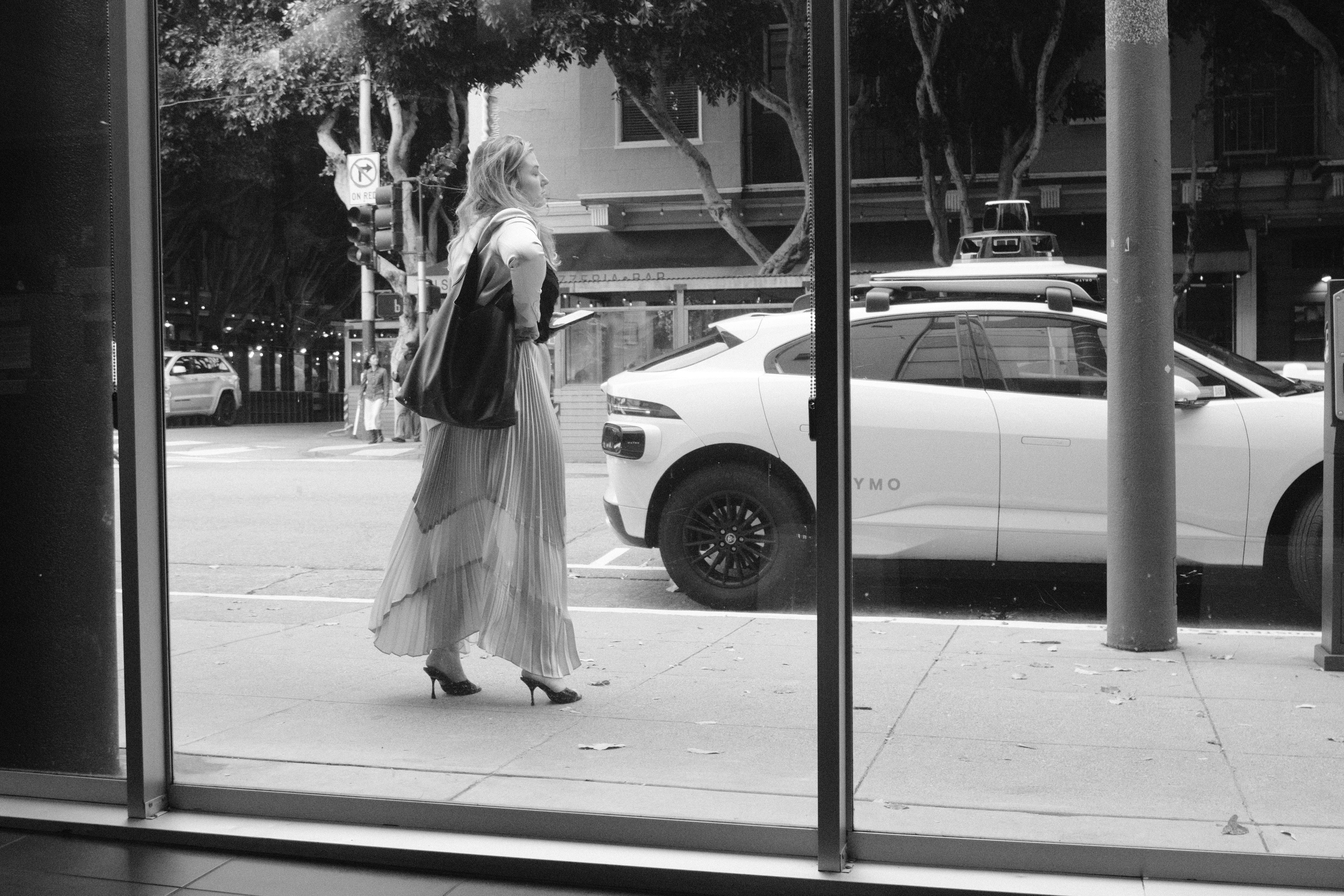 Windowed Stride: A City Moment in Monochrome