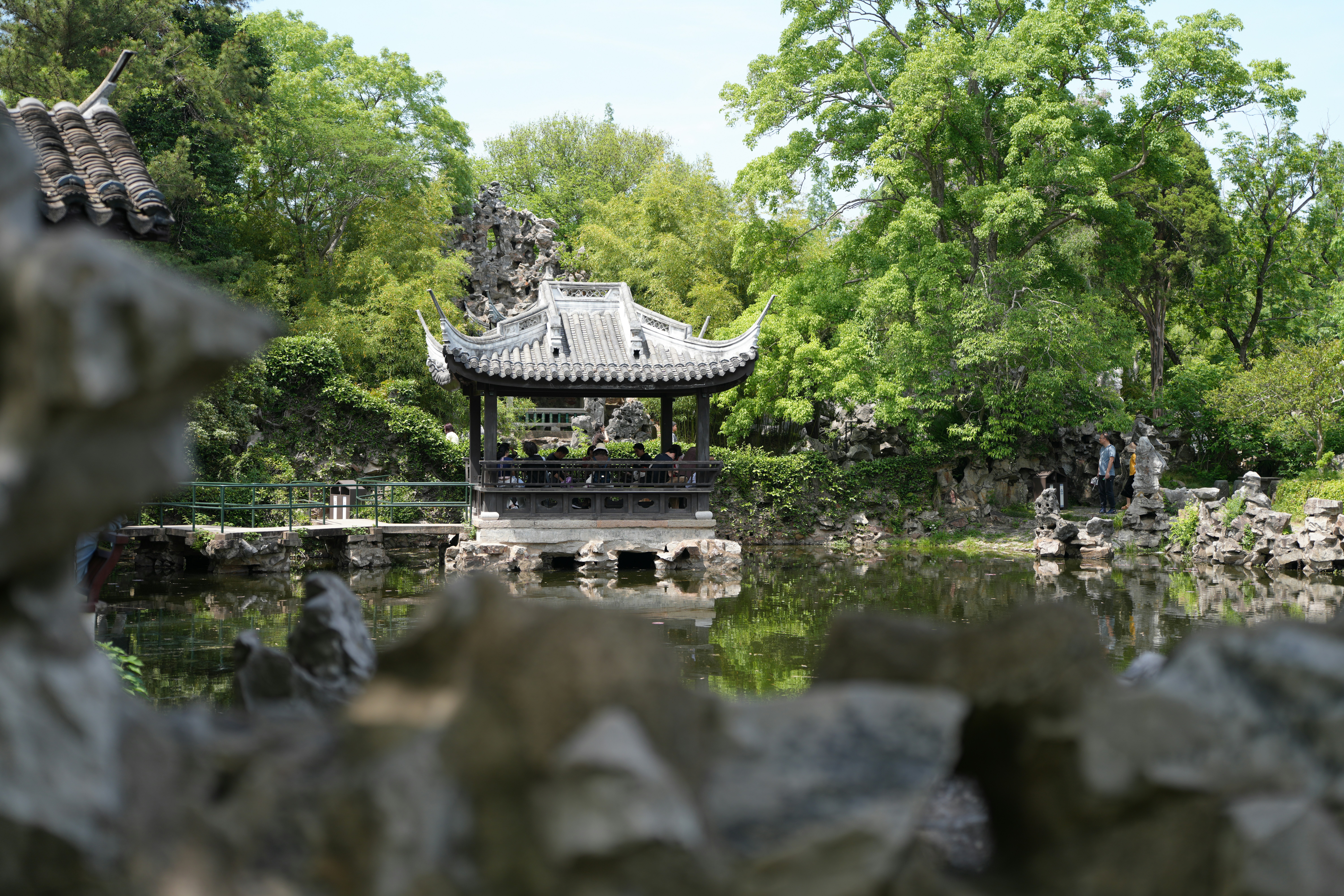 Hidden Pavilion Over Pond: A tranquil Chinese Garden Scene