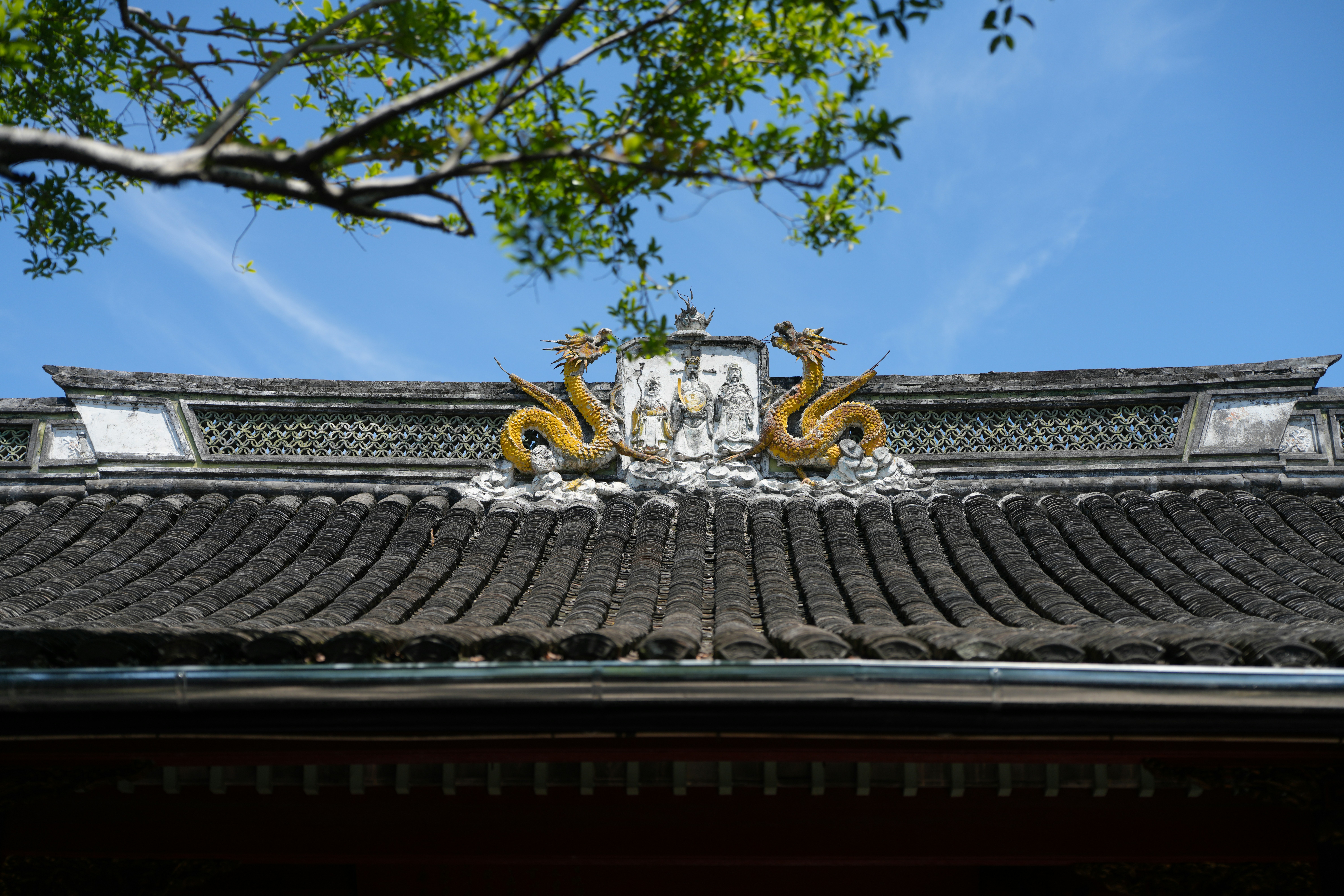 Dragon-guarded Tilecrest: A Crest of Dragons Above the Roofline