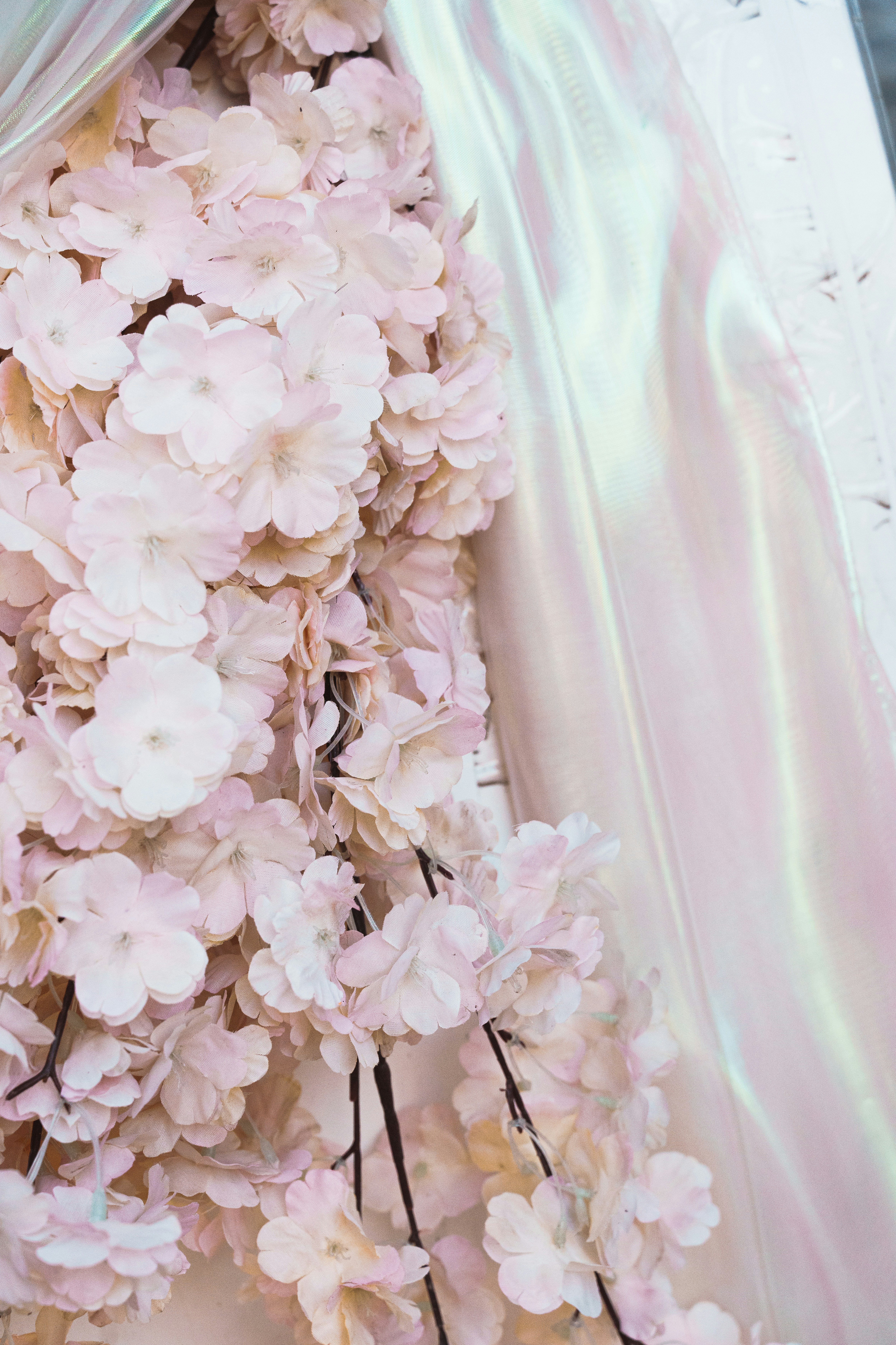 Blush Hydrangea Cascade Against Iridescent Drapery
