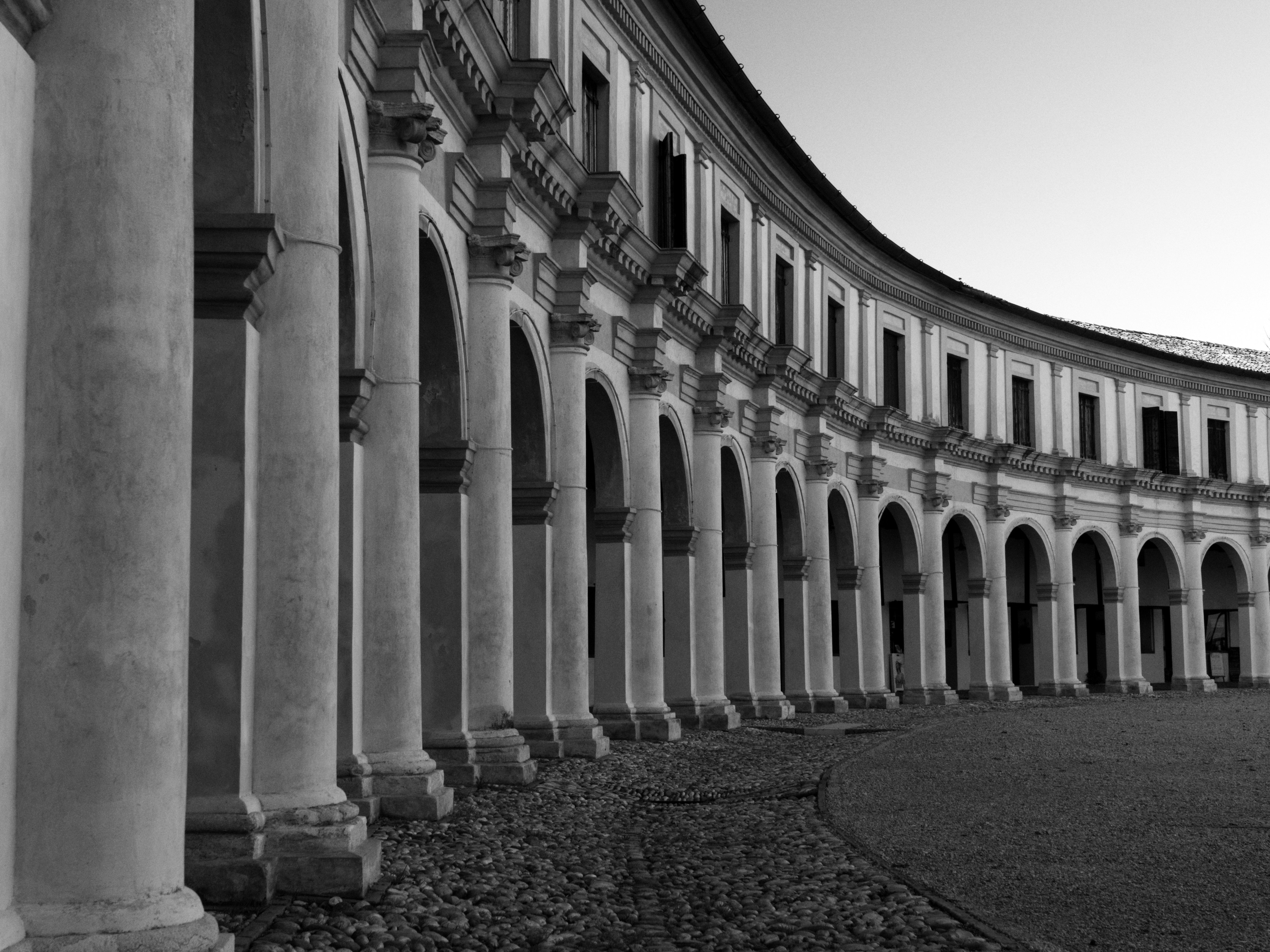 Curved Colonnade in Monochrome: Silent Arc of Stone