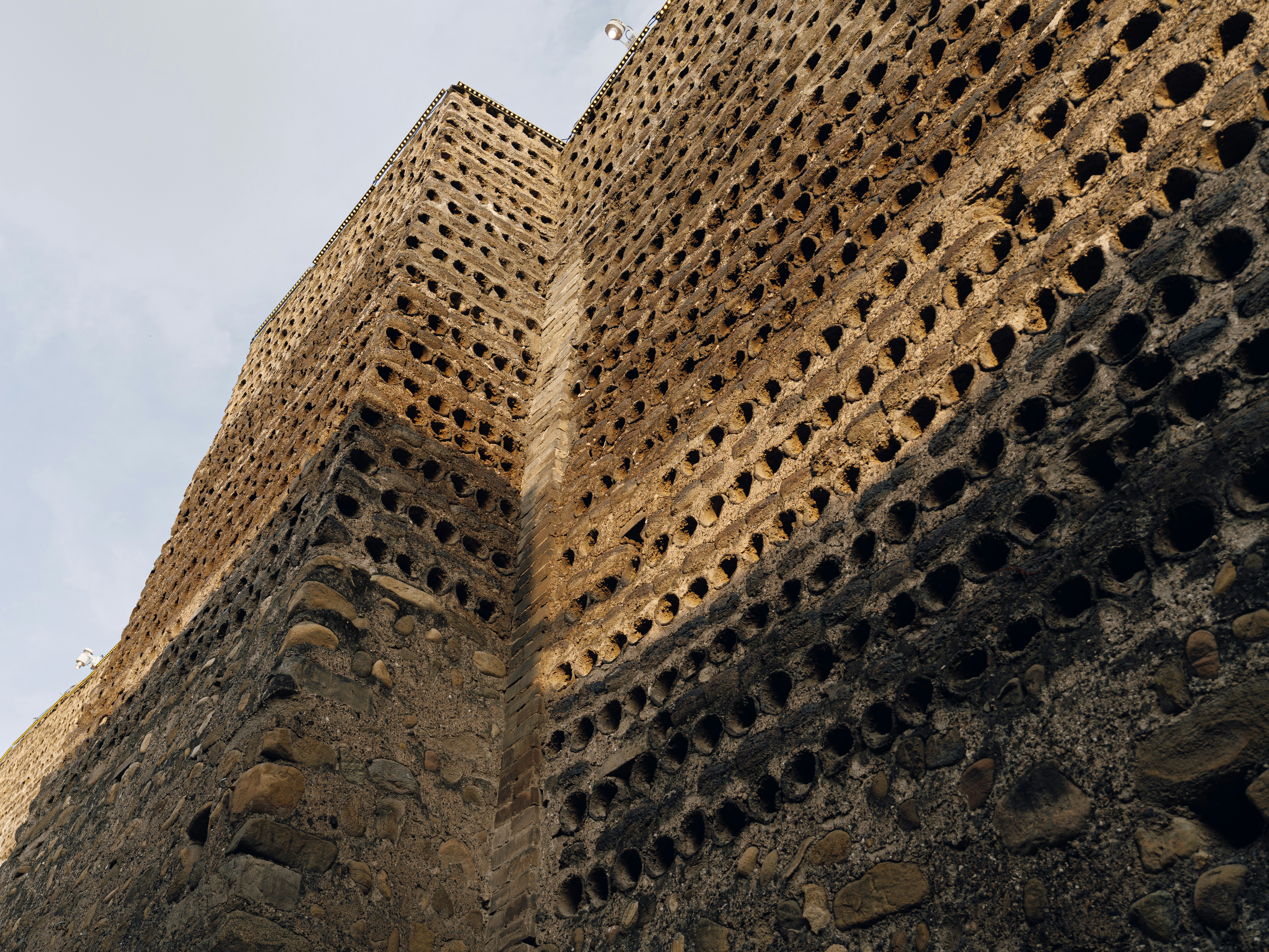 Ancient Brickwork with Cascading Arches and Weathered Texture