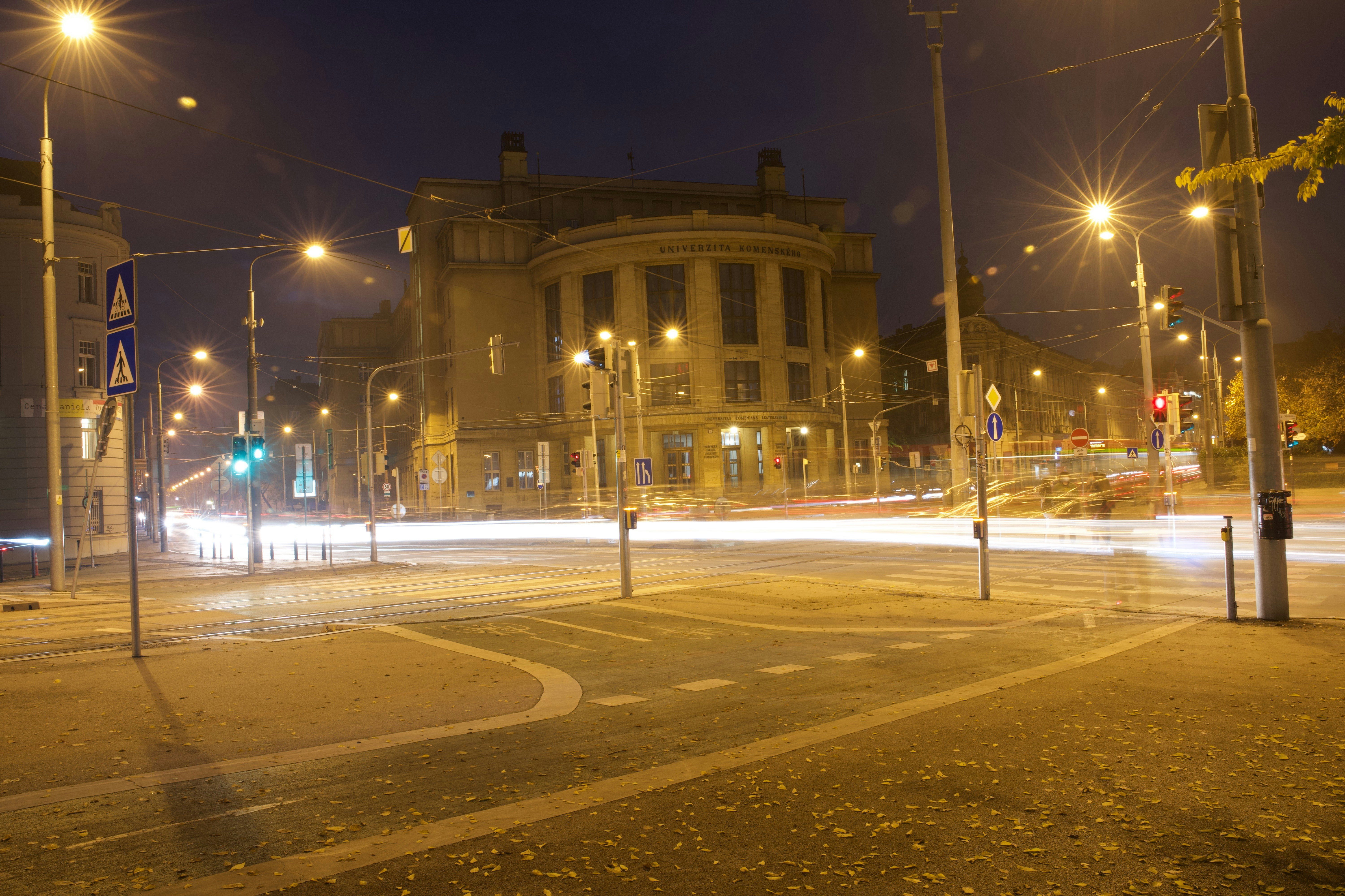 Night at the Corner: A Quiet City Block with Streaking Lights