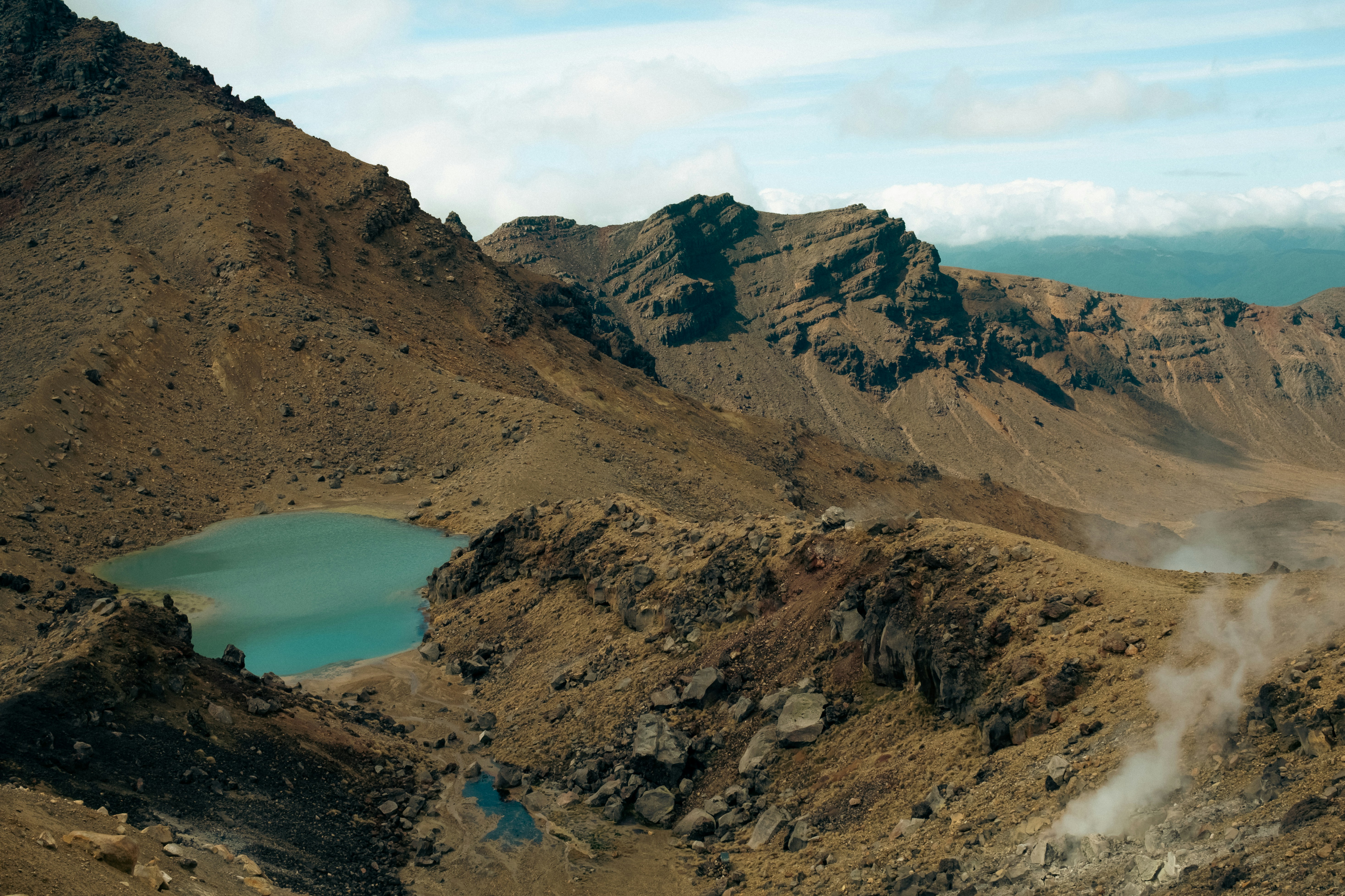 Emerald Crater Lake Amid Volcanic Ridges