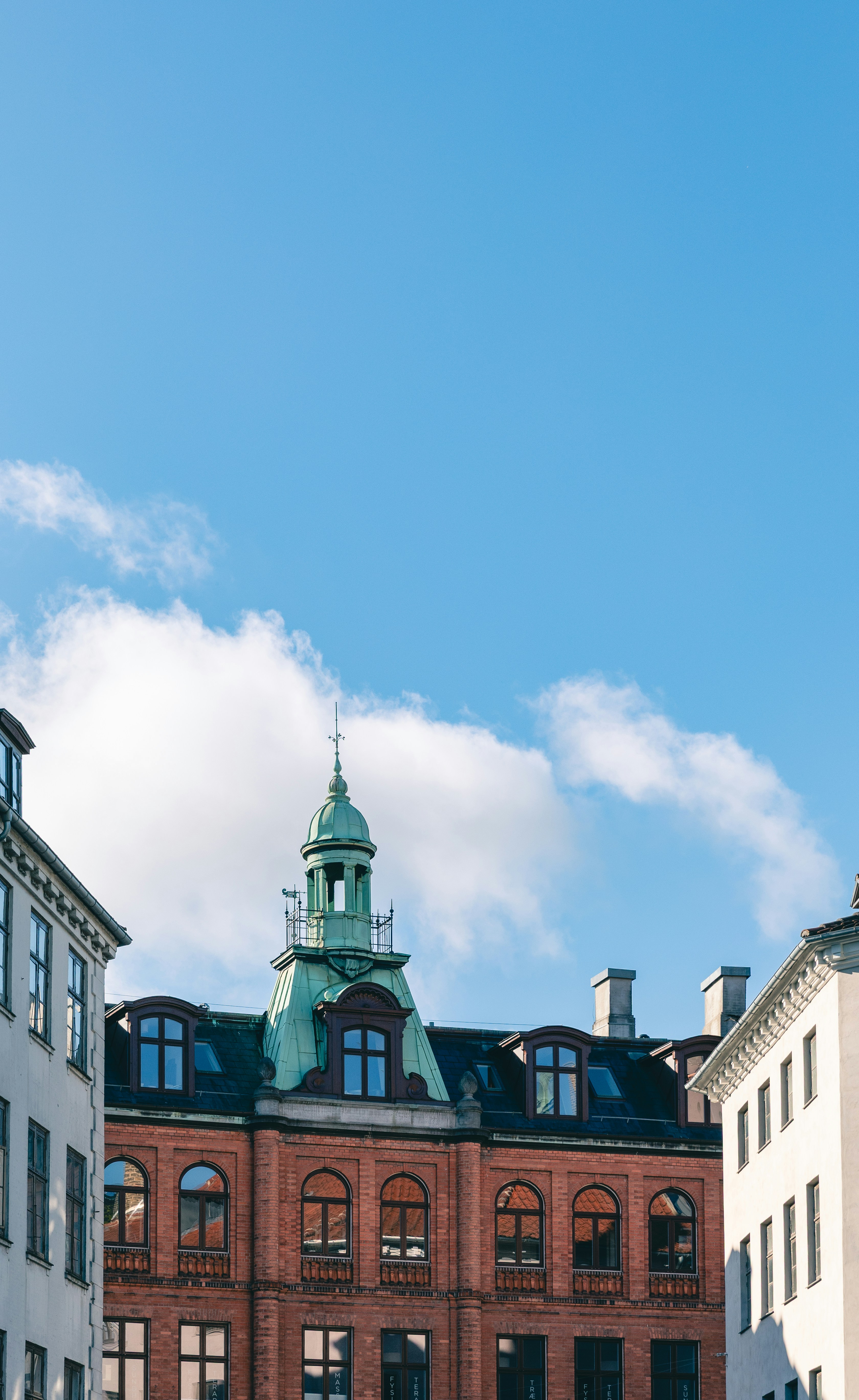 Brick Arches and Sky: City Edges Under Blue
