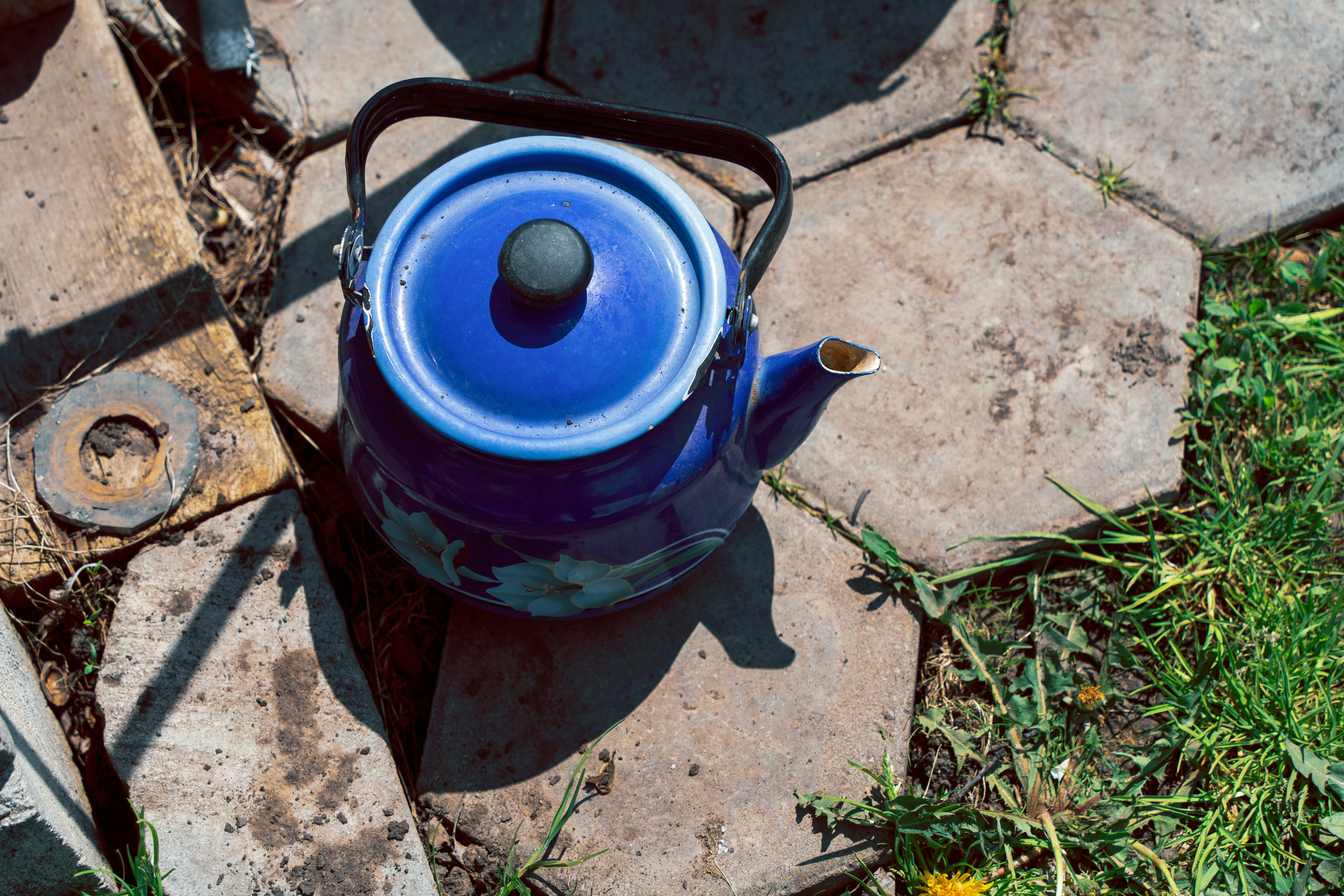 Blue Kettle on Weathered Stone: Morning Light and Shadow