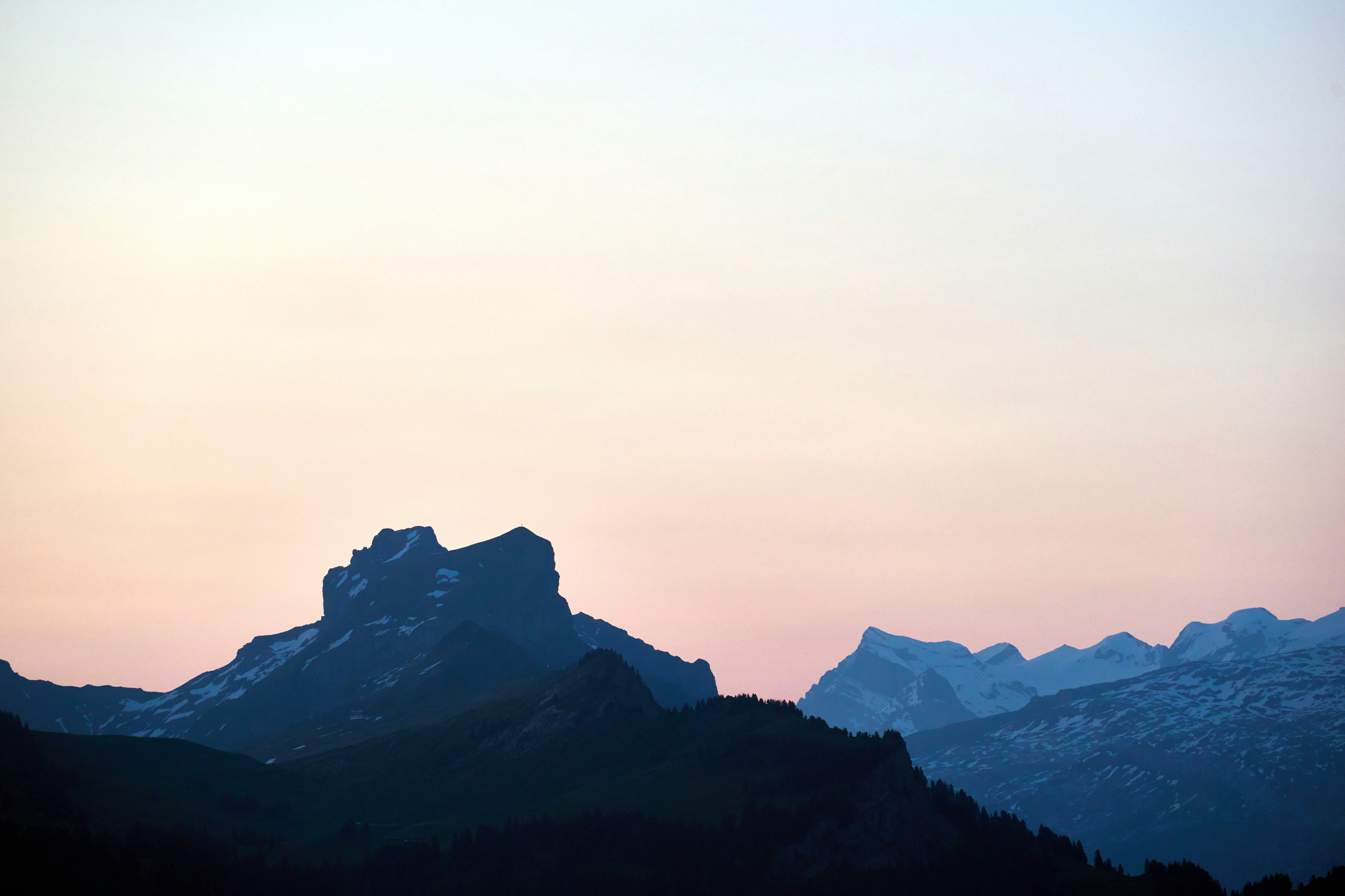 Distant Peaks at Dusk: A Serenade of Quiet Horizon