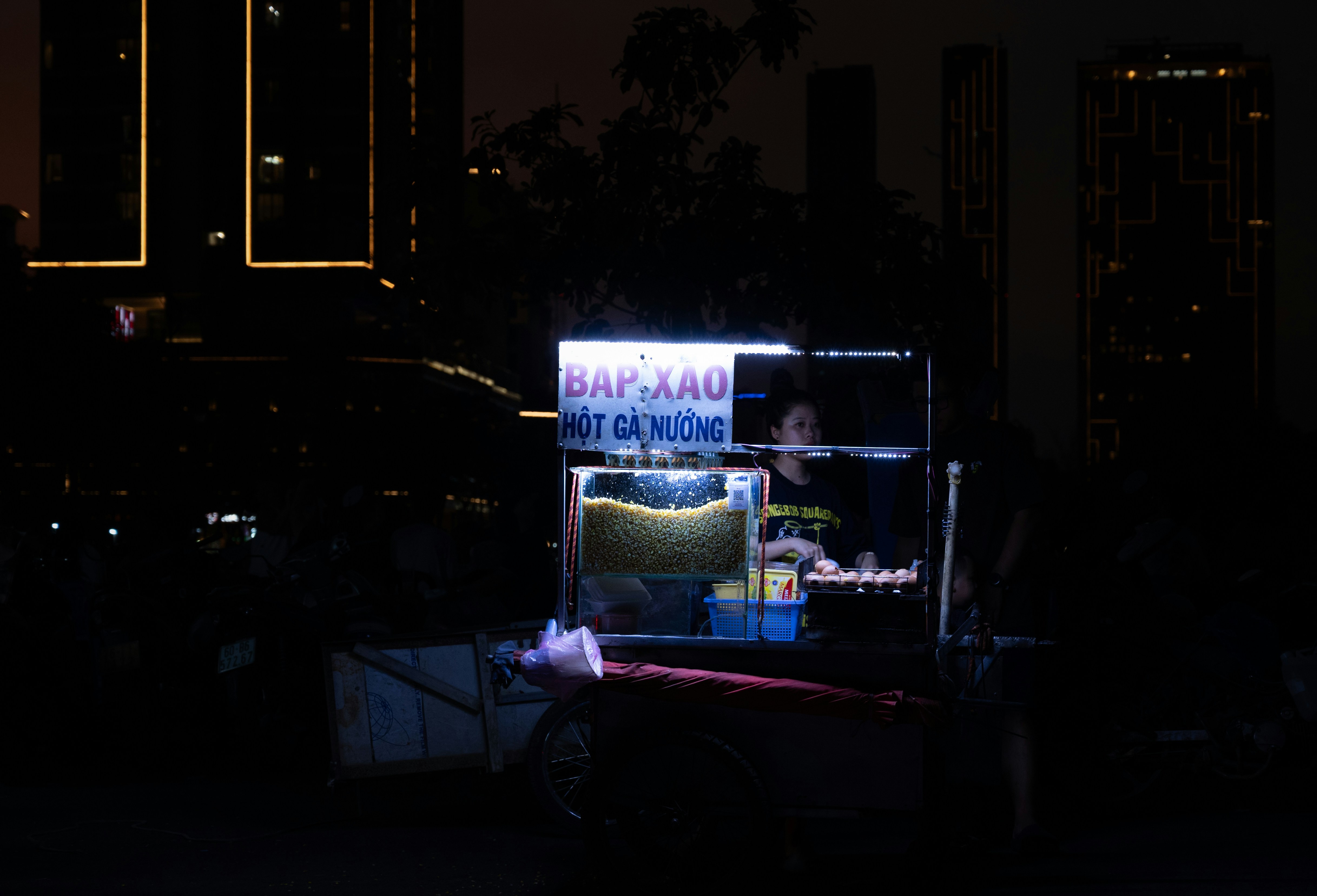 Night market cart: steaming corn and neon glow