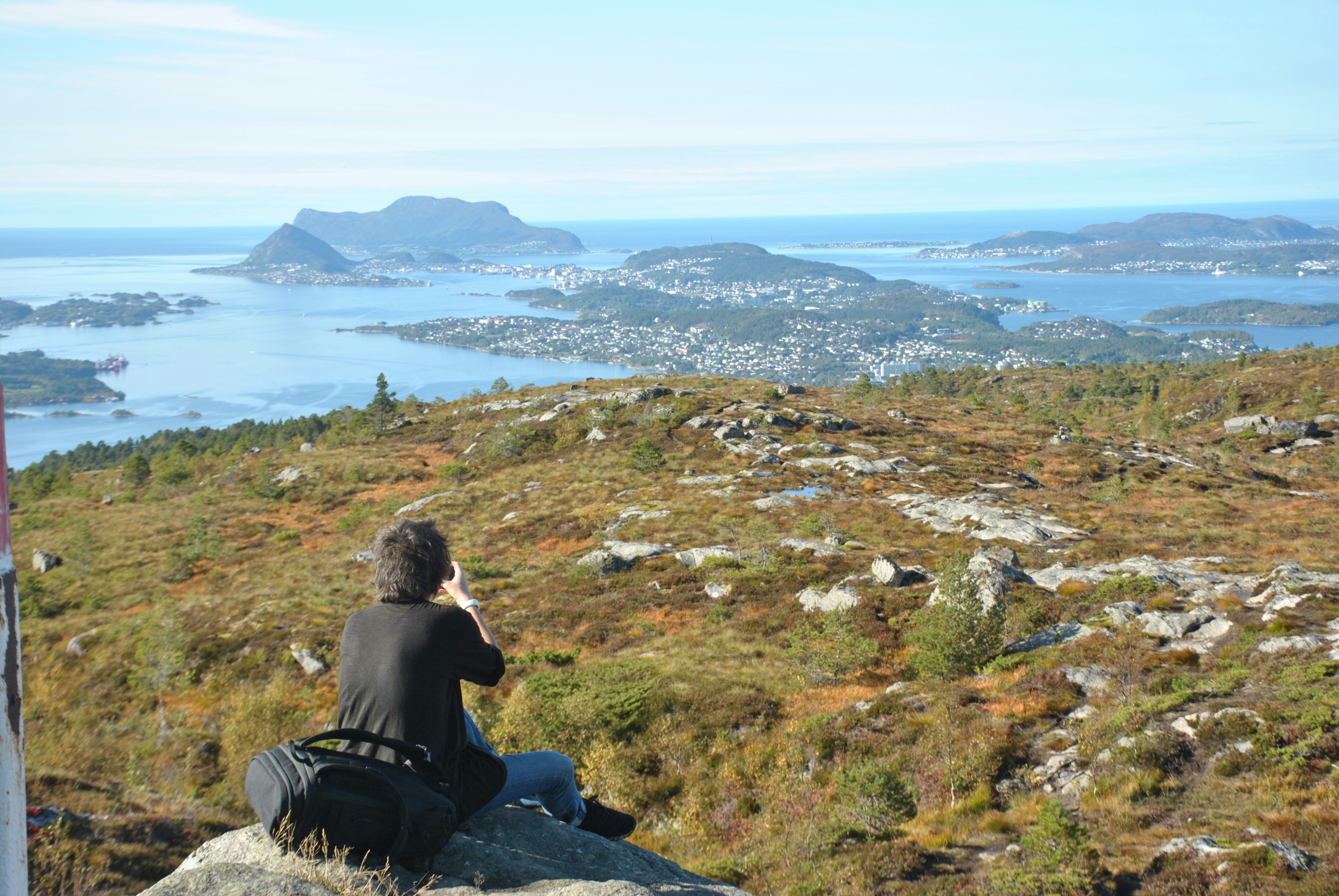 Person at a Scenic Coastal Ridge, Back View in Quiet Dusk Light