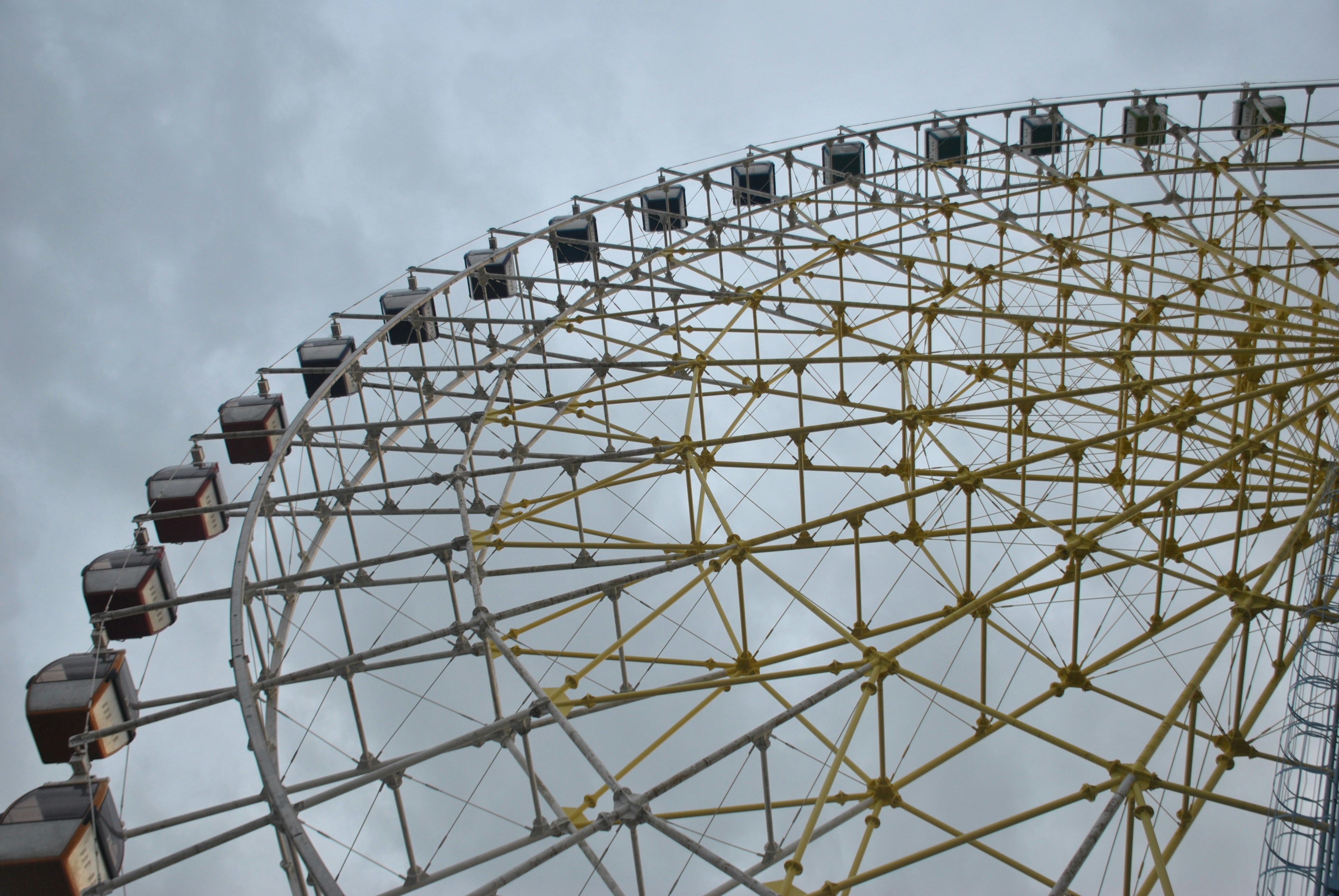Rusted Geometry: A Ferris Wheel under a Brisk Sky