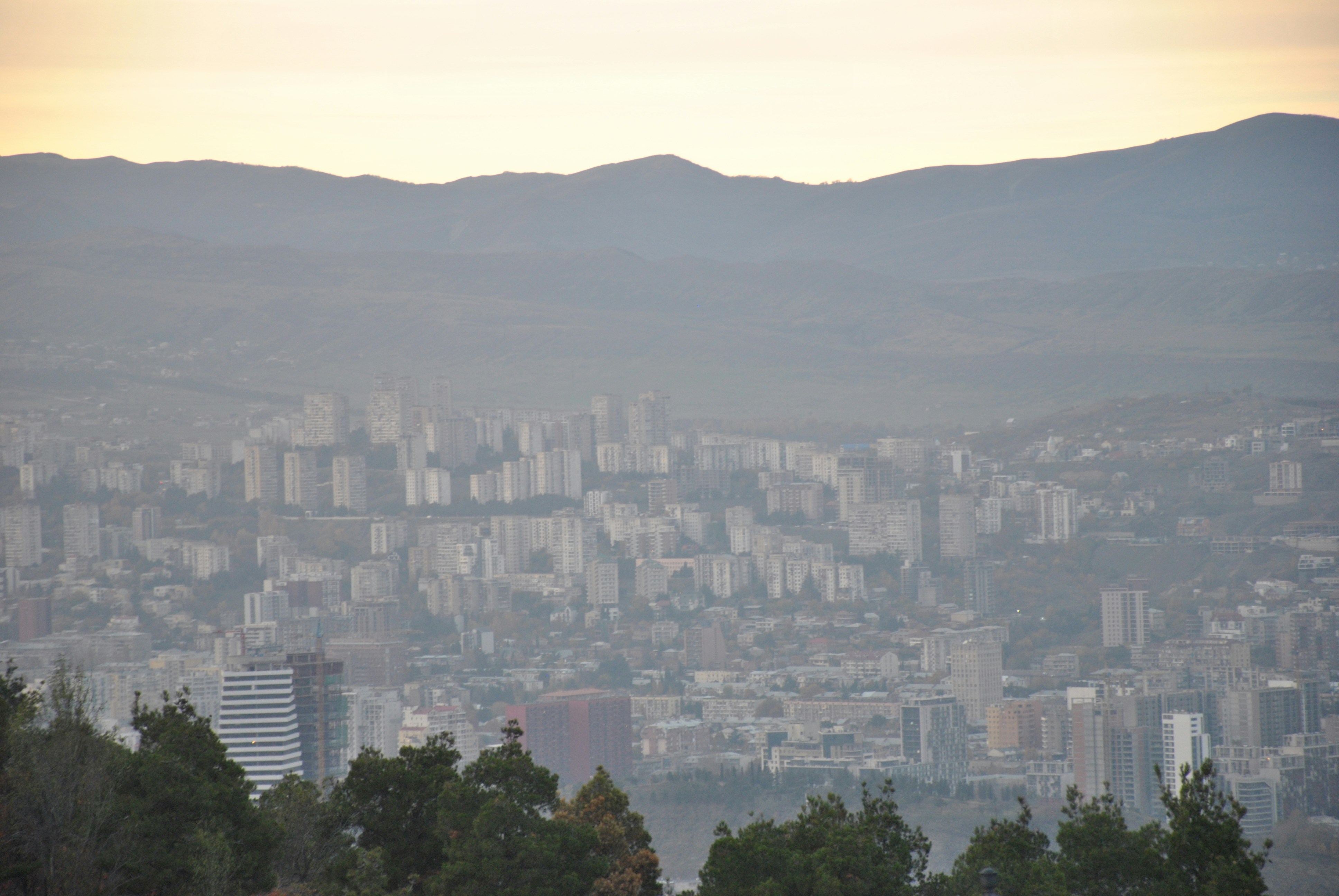 Cityscape at Dusk: Hills Framing the Urban Sea