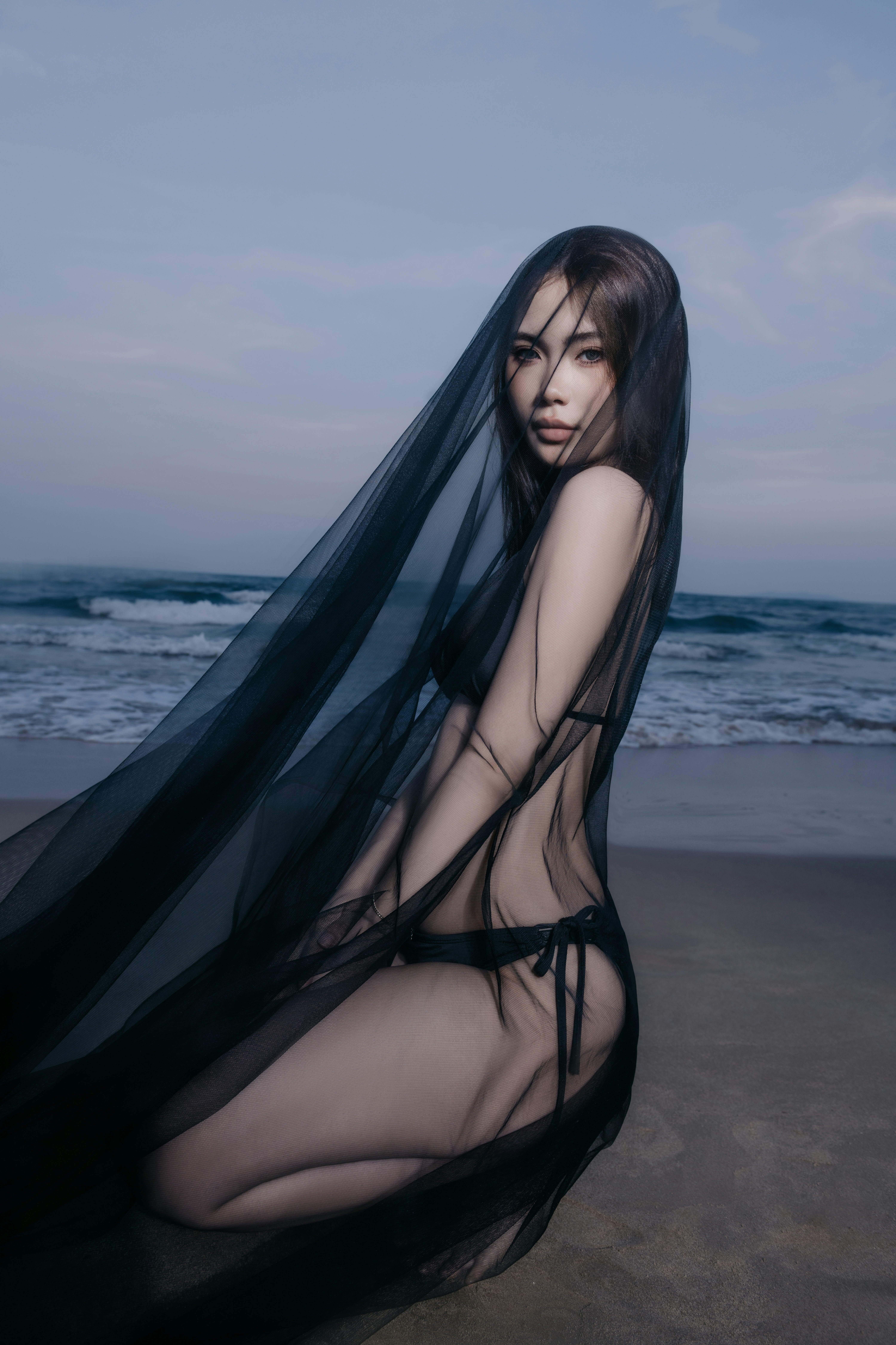 Veiled by the Sea: A Veiled Pose on the Quiet Shore