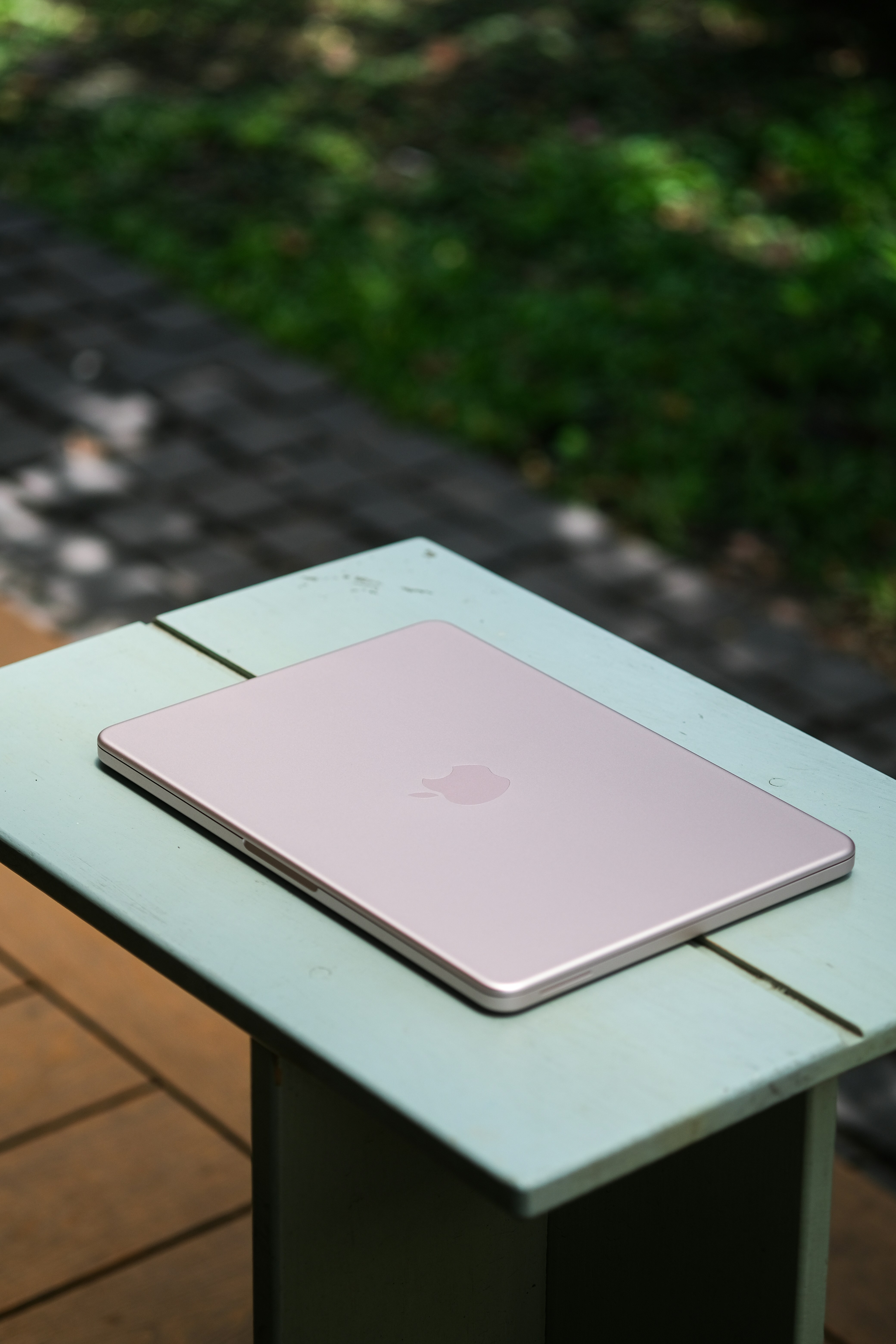 Rose-Gold Laptop on a Mint-Blue Picnic Table