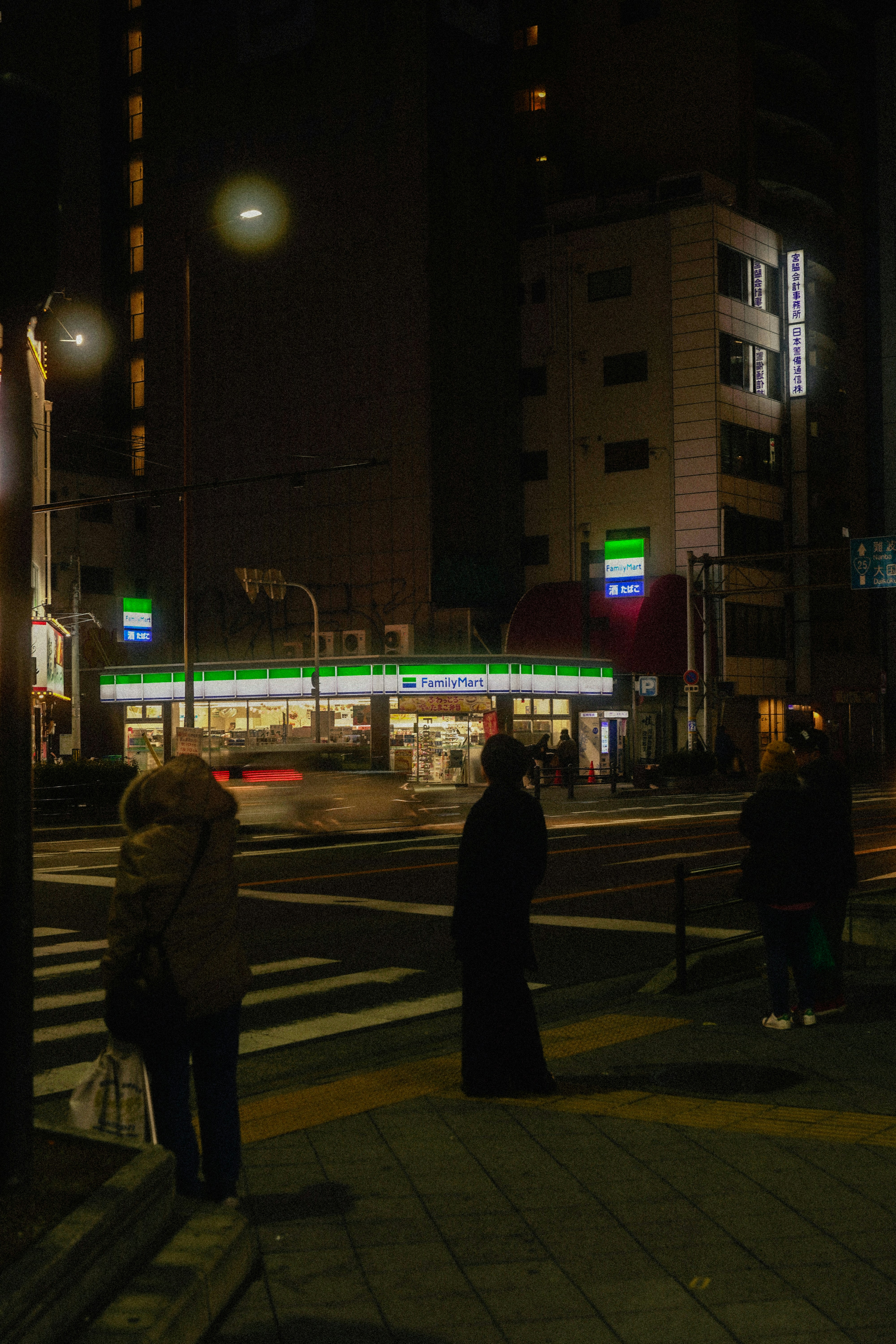 Night Walk to the Quiet Convenience: A Dimly Lit Street Scene