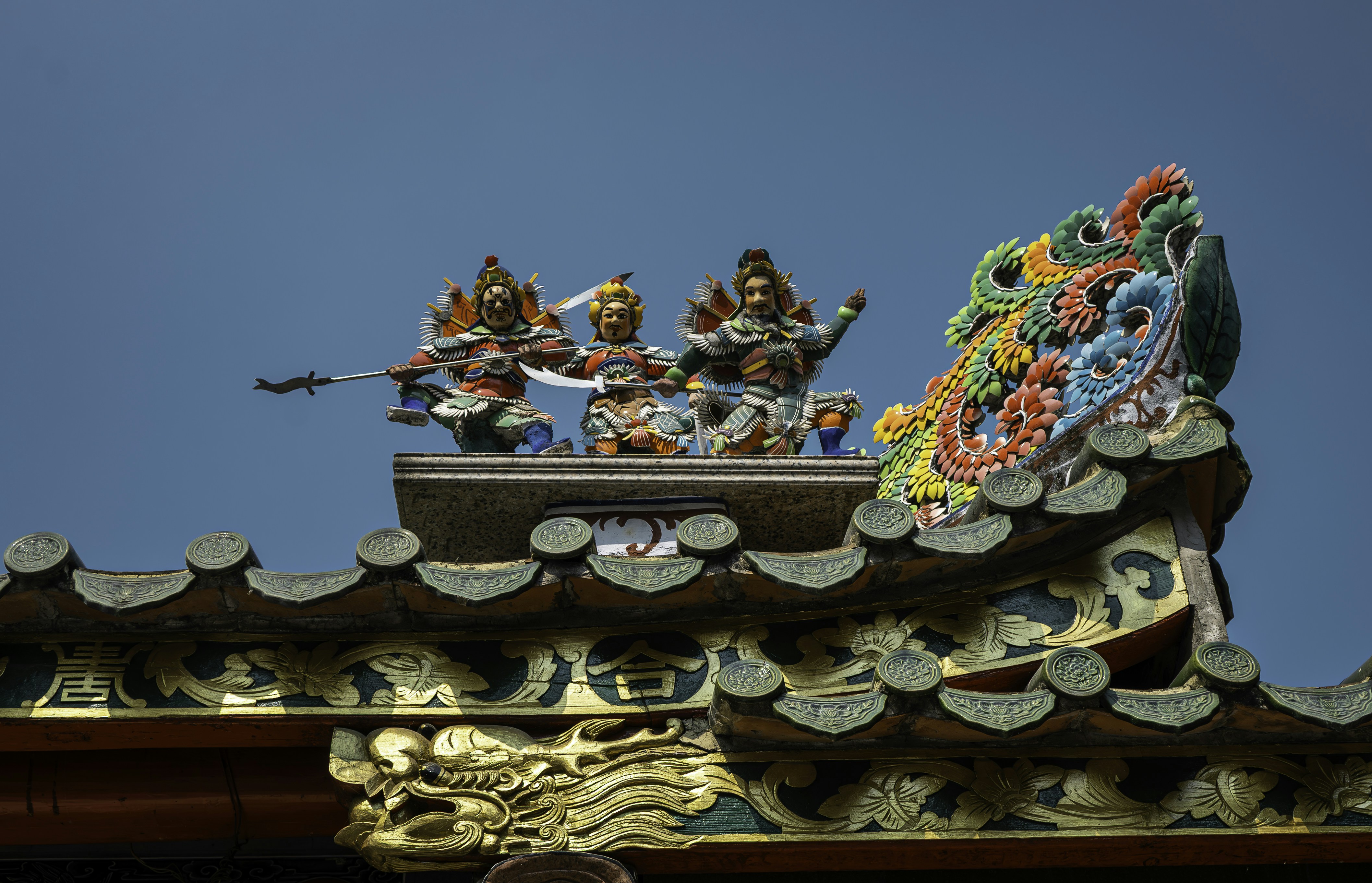 Figures of Courage Crown the Temple Roof