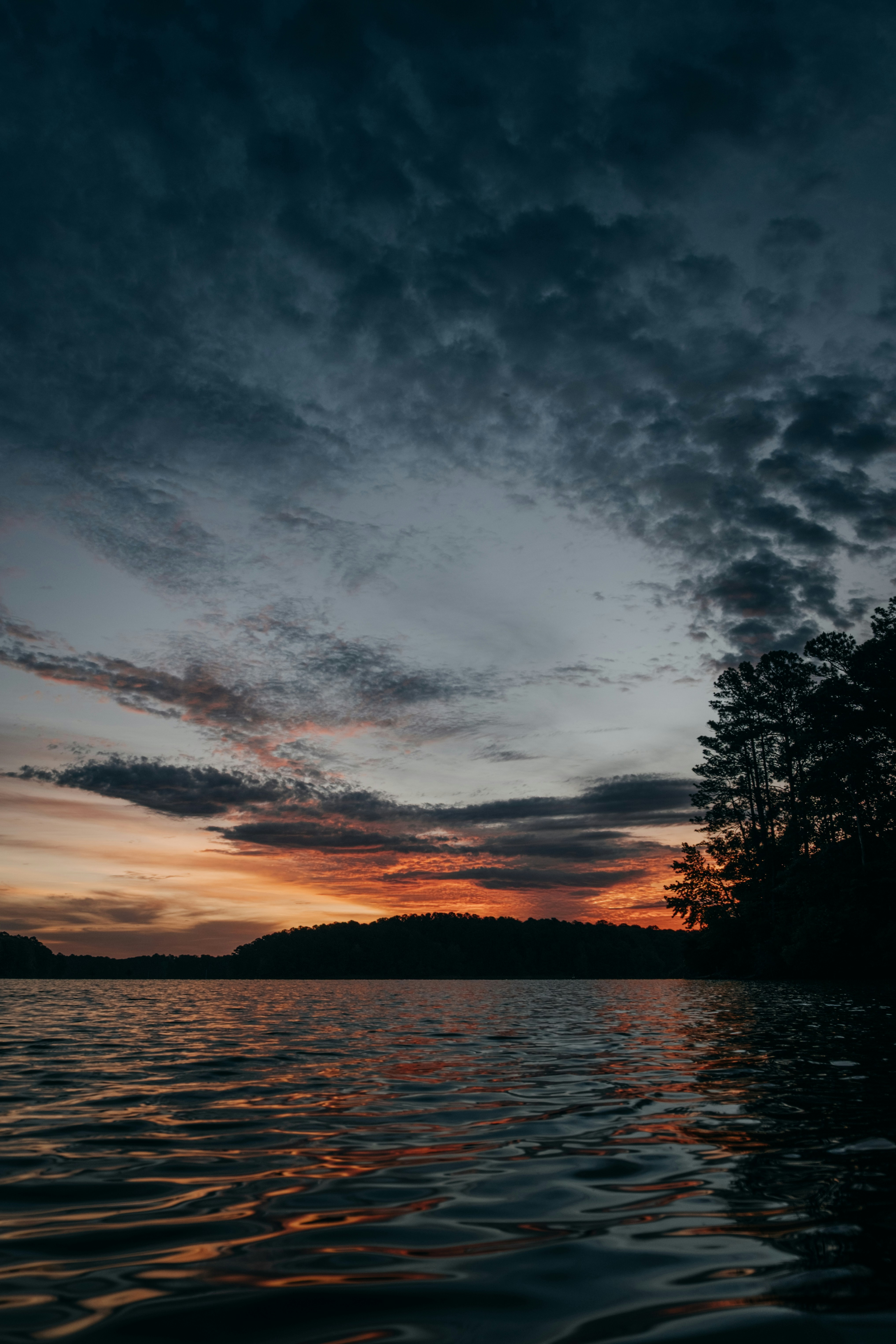 Twilight on the Quiet Lake: Silhouettes at Dusk
